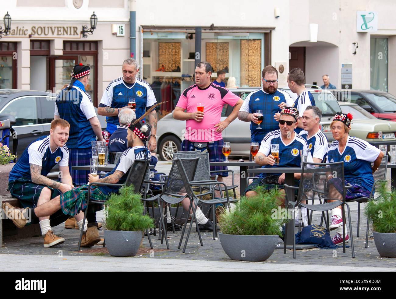 Group of middle age Scotland football team fans in national clothes ...