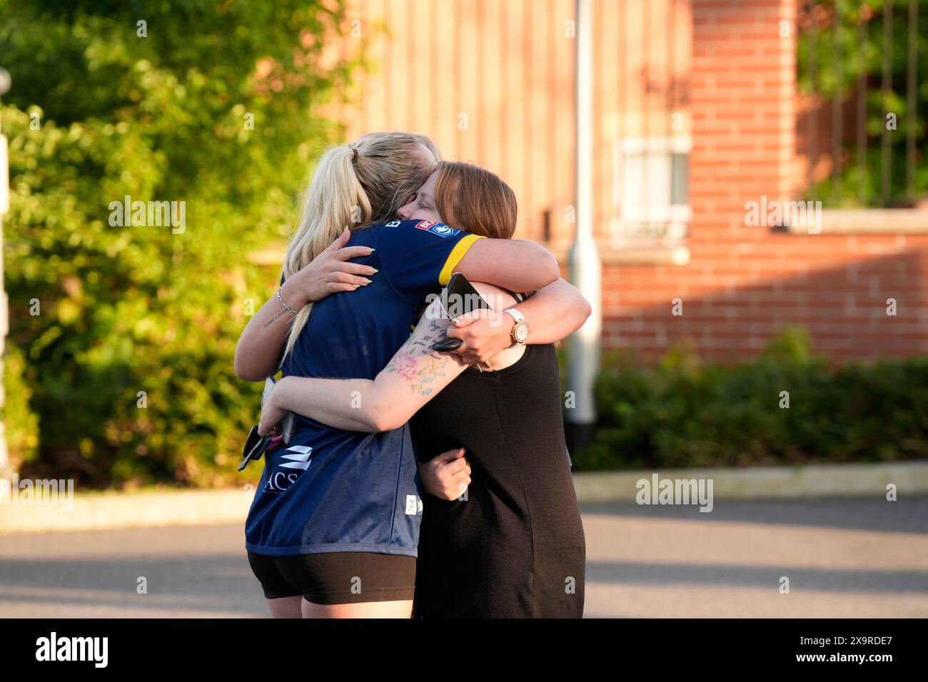 Fans hug each other outside headingley stadium in leeds, after the ...
