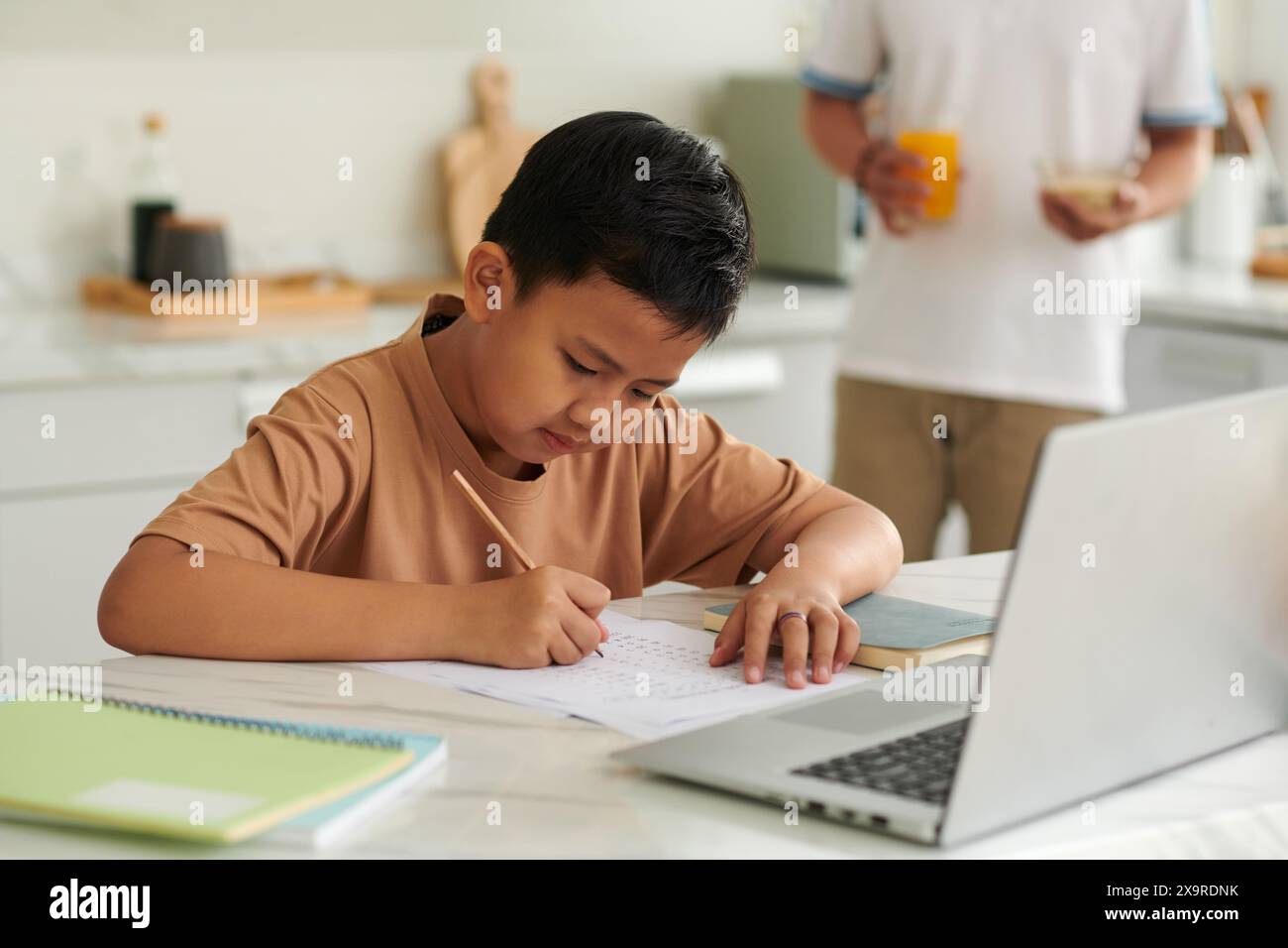 Asian boy doing math homework hi-res stock photography and images - Alamy