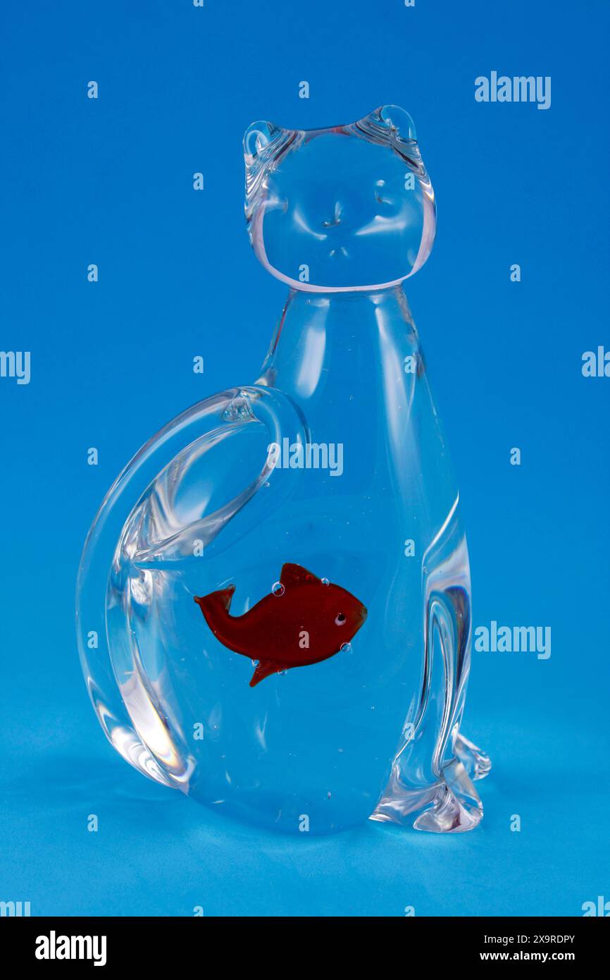 Crystal figure in the shape of a cat that contains a fish inside ...