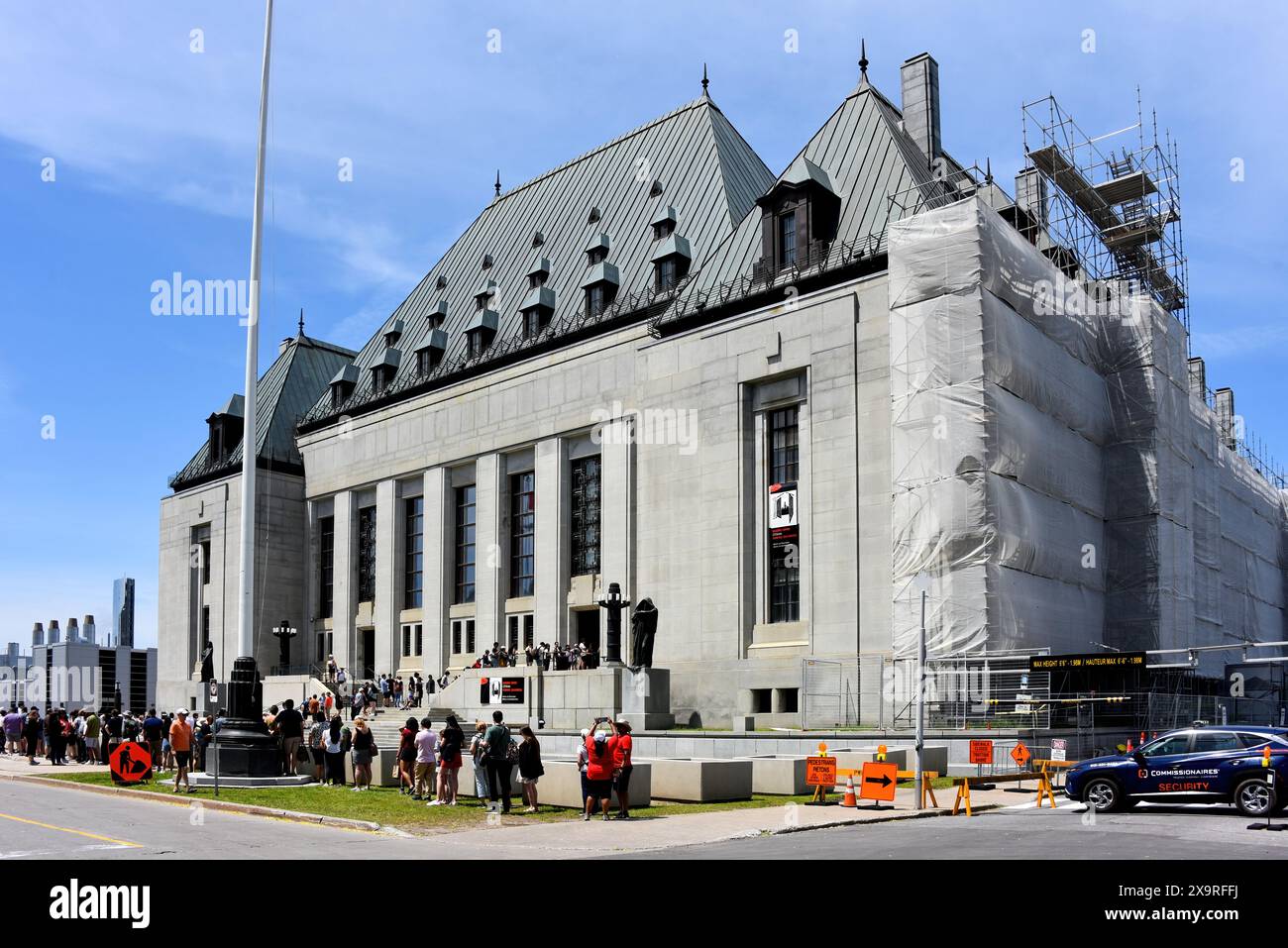 Ottawa, Canada - June 1, 2024: A group of people line up to see inside ...