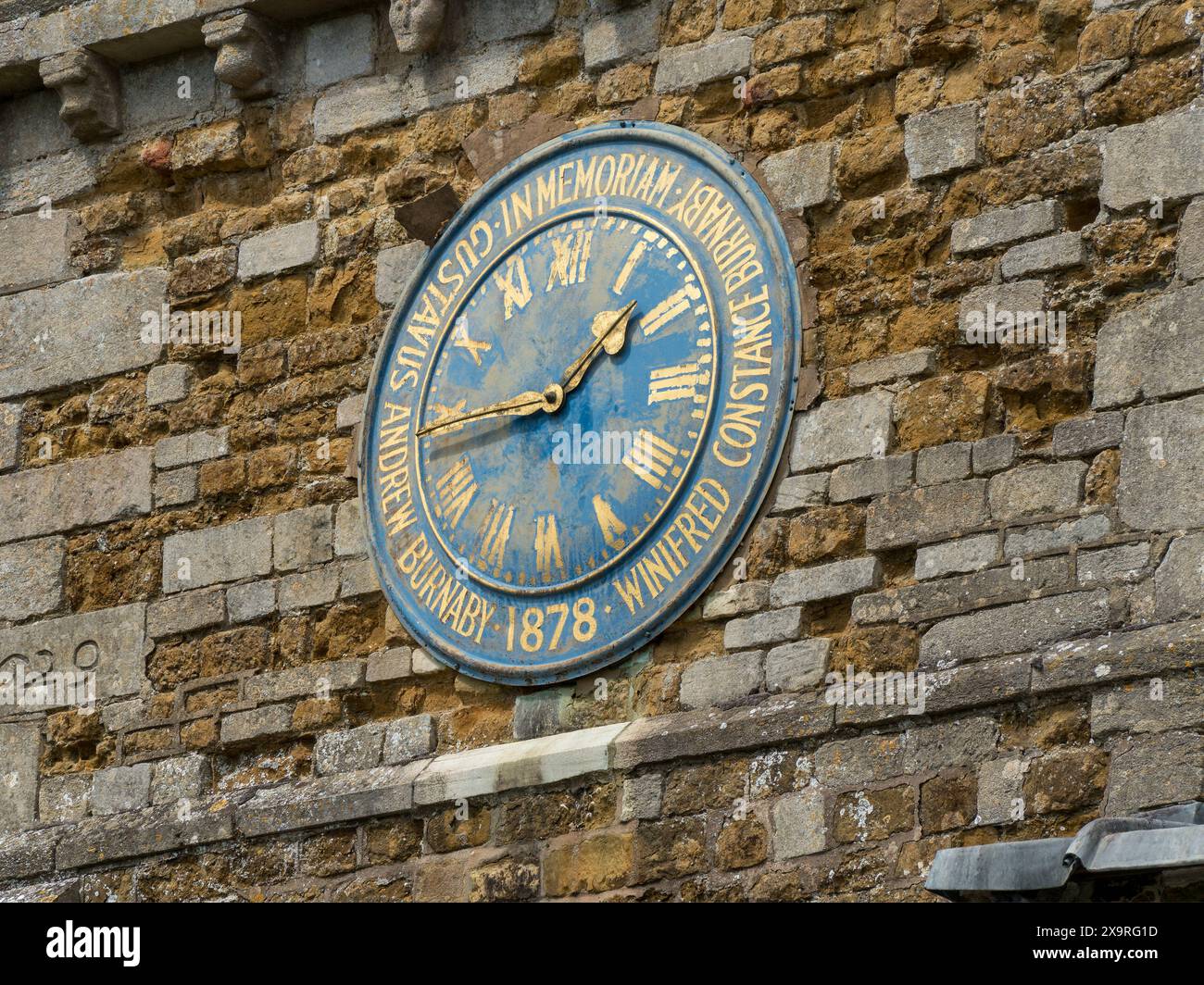Old church clock with blue face and gold hands and Roman numerals ...