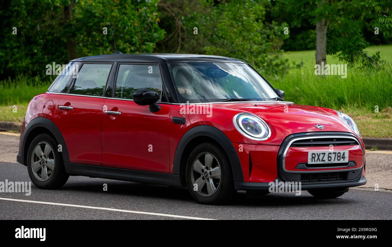Milton Keynes,UK - May 27th 2024: 2022 red Mini Cooper car driving on a ...