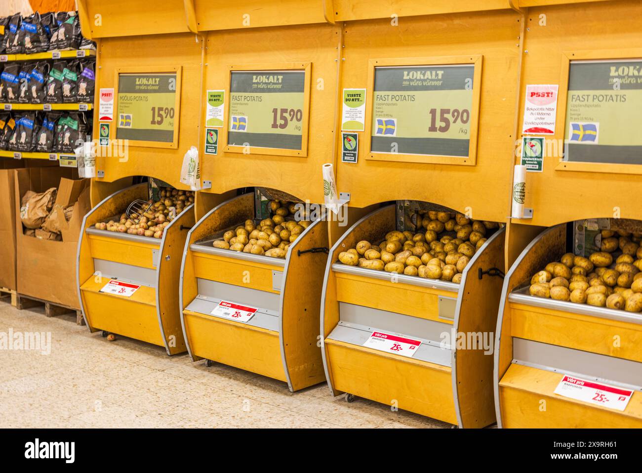 Close-up view of the vegetable aisle with potatoes in the supermarket ...