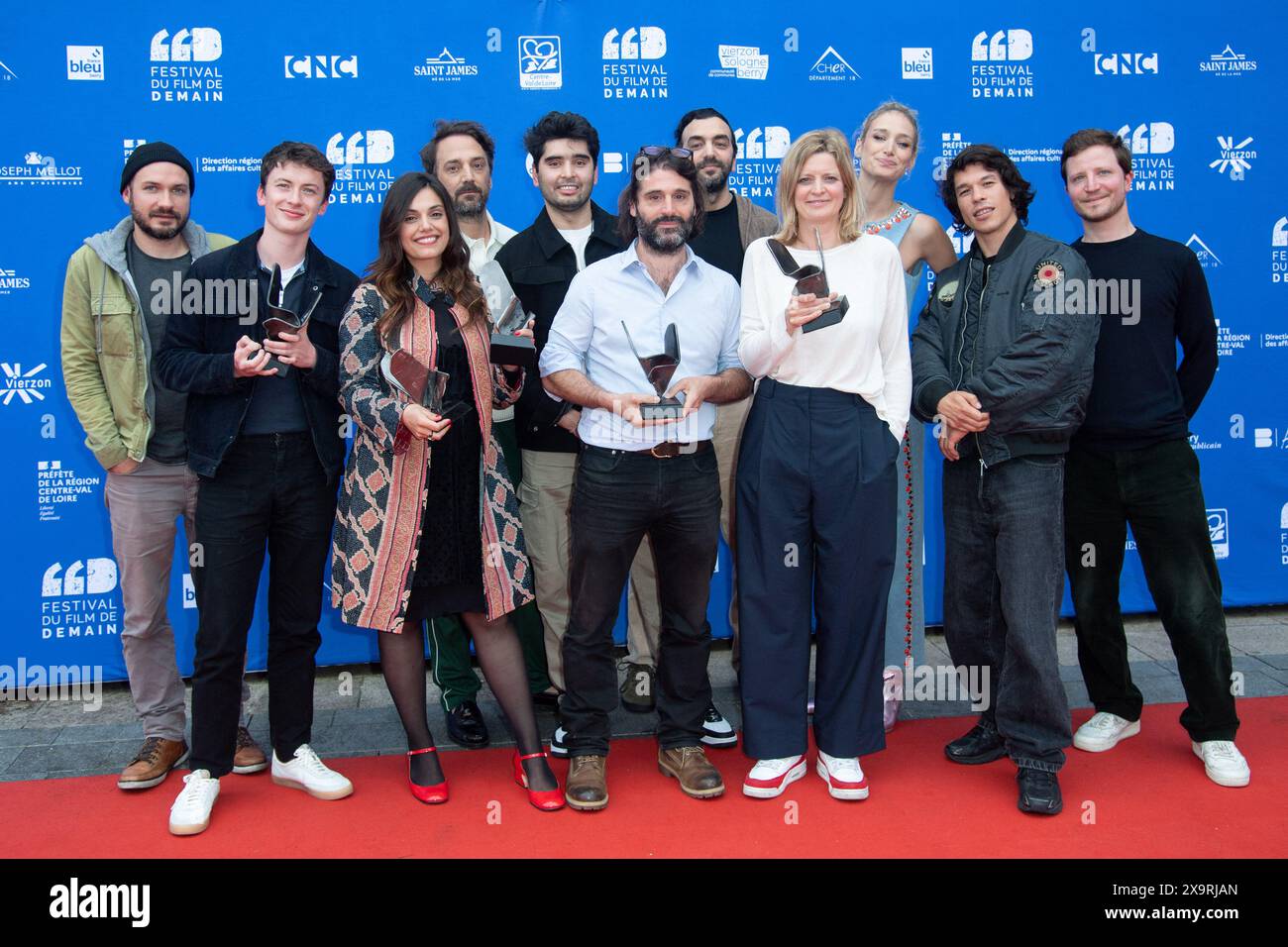 Paul Lenoir posing with his Award for the Best Short Movie with the ...