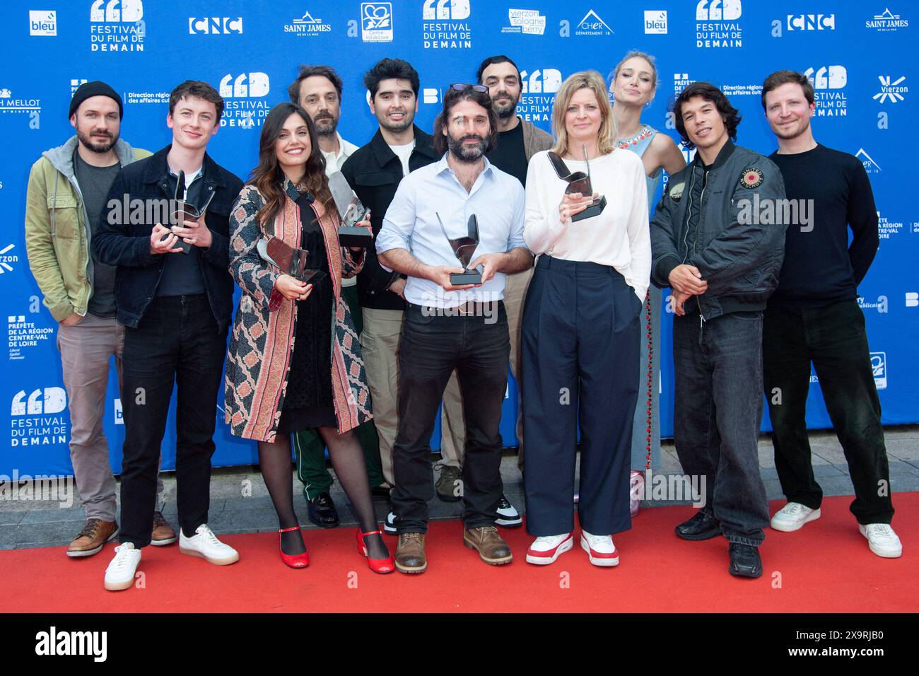 Paul Lenoir posing with his Award for the Best Short Movie with the ...