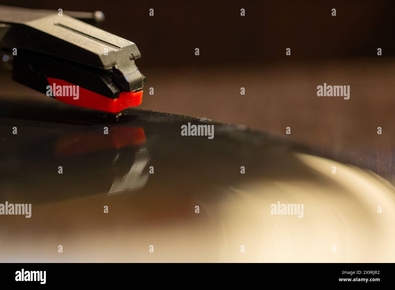 vinyl record with clear sound tracks and stylus, focus on sound tracks ...