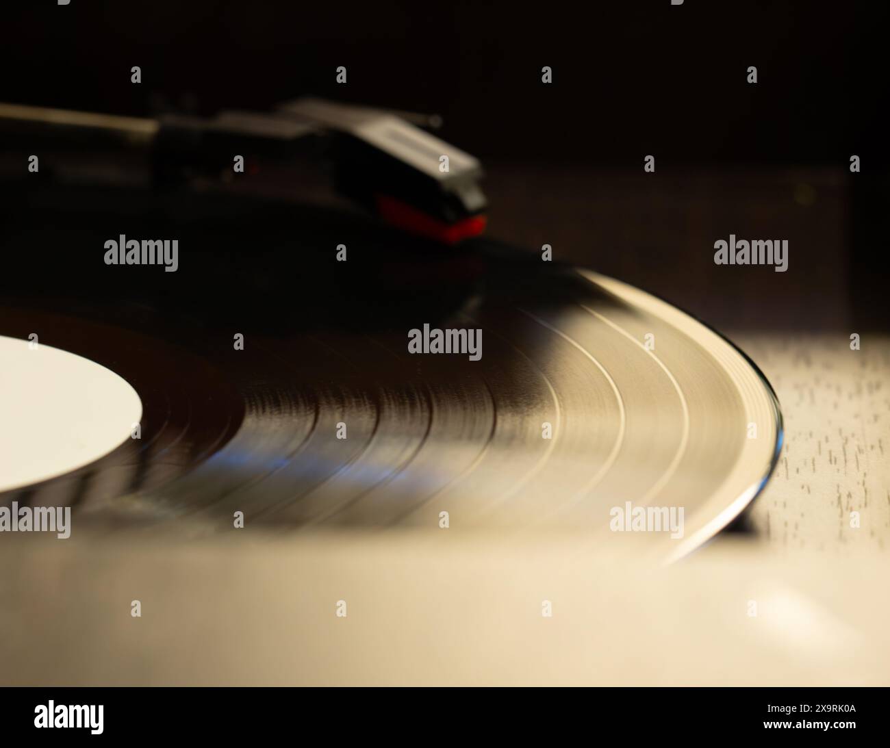 vinyl record with clear sound tracks and stylus, focus on sound tracks ...