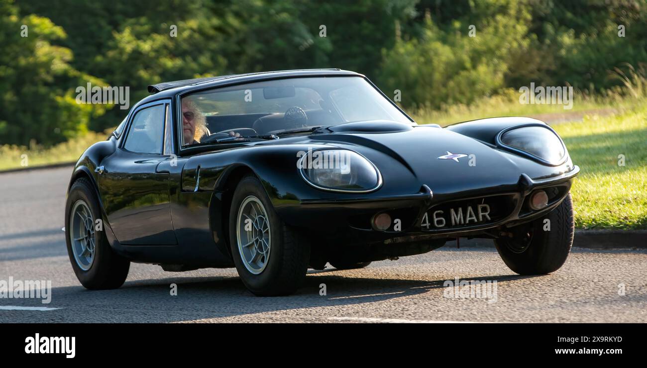 Stony Stratford,UK - June 2nd 2024: 1969 Marcos classic car driving on ...