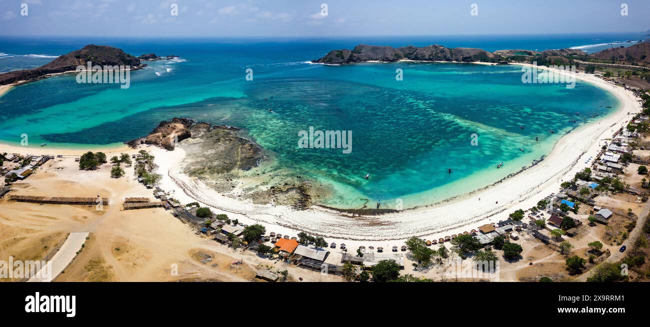 Panoramic aerial view of a stunning tropical beach inside a sheltered ...