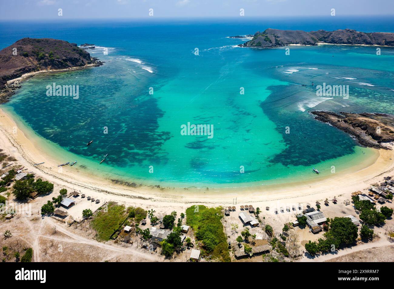 Panoramic aerial view of a stunning tropical beach inside a sheltered ...
