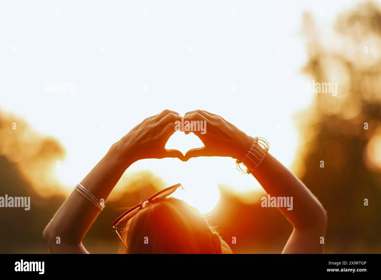 Summer time. happy modern 40 years old woman in white shirt showing ...