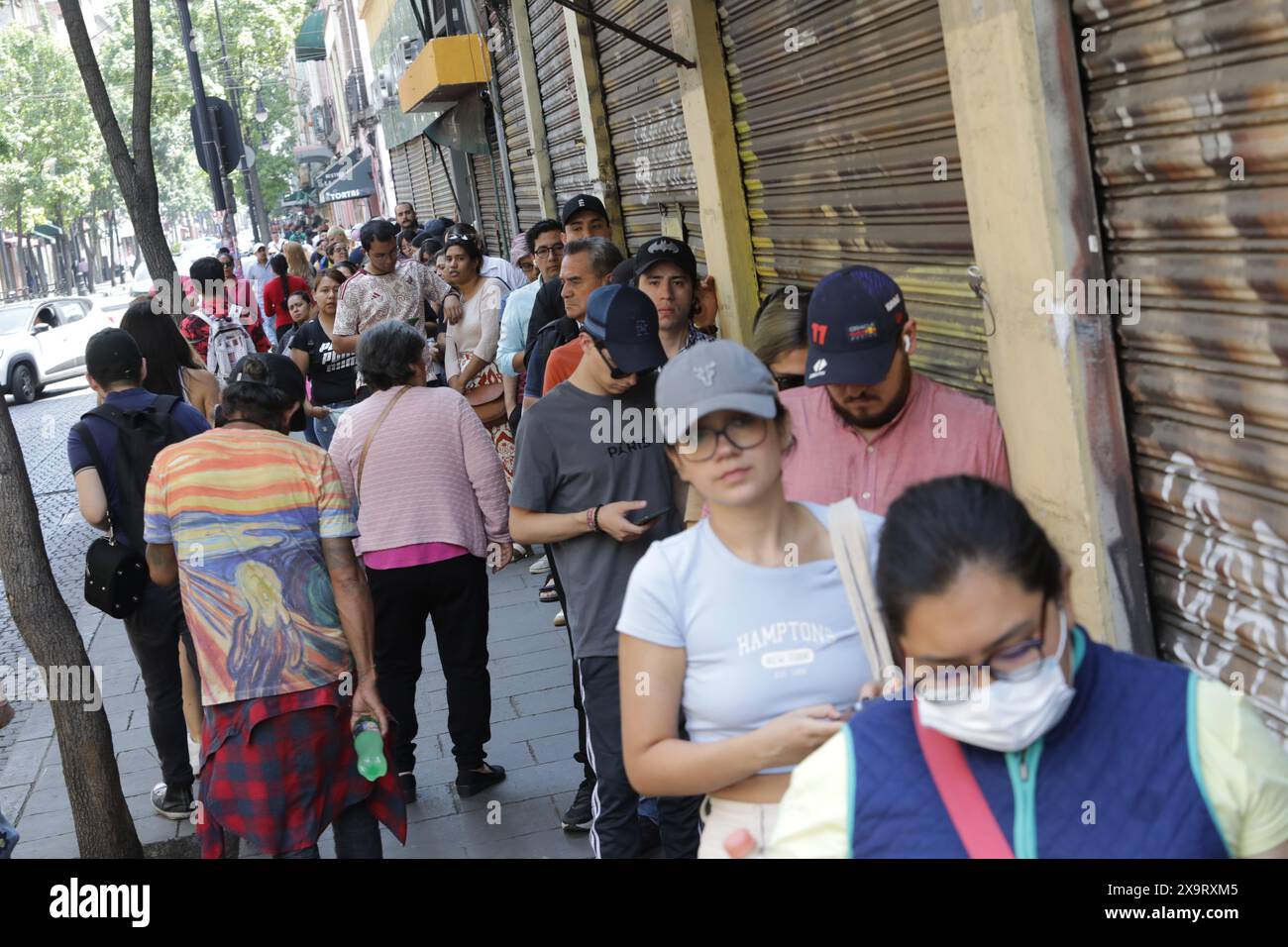 Mexican citizens line up to casting their vote at a Electronic ballot ...