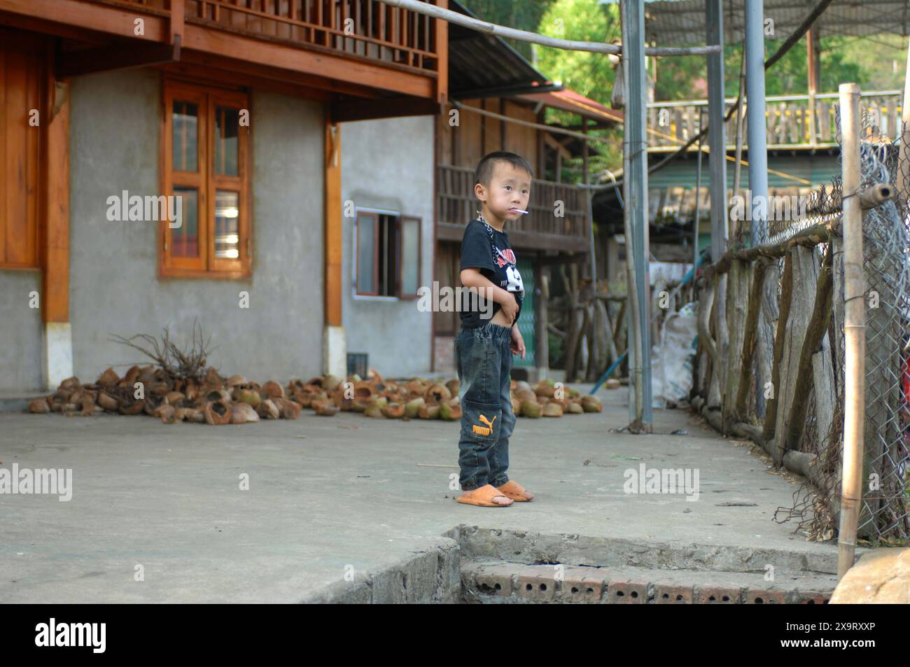 Young Vietnamese boy outside his home, Cat Cat village, Sapa, Lao Cai, Vietnam Stock Photo - Alamy
