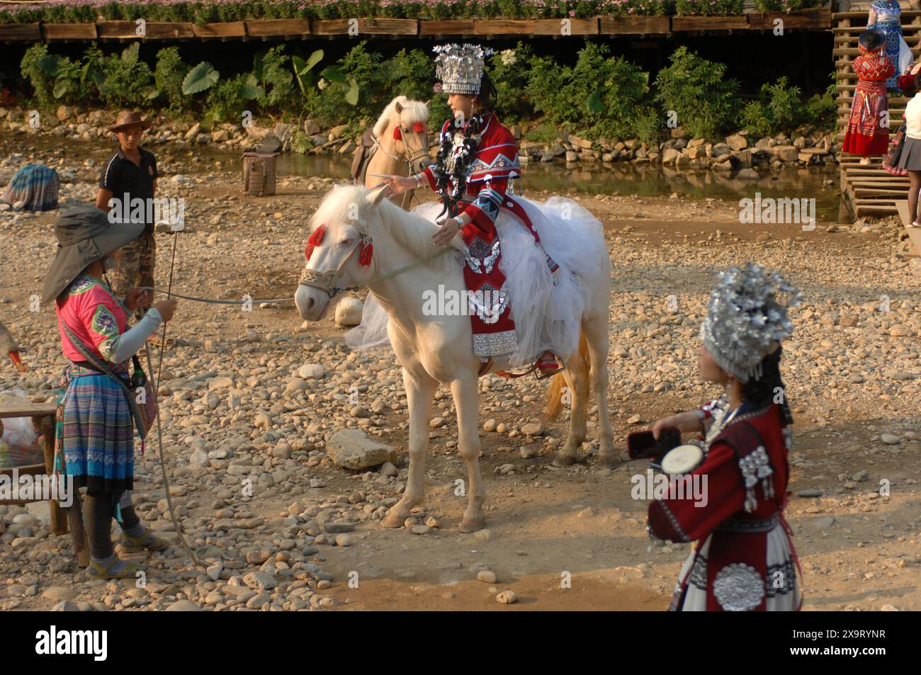 Tourist dressed up in Hilltribe traditional attire sat om a horse, Cat ...