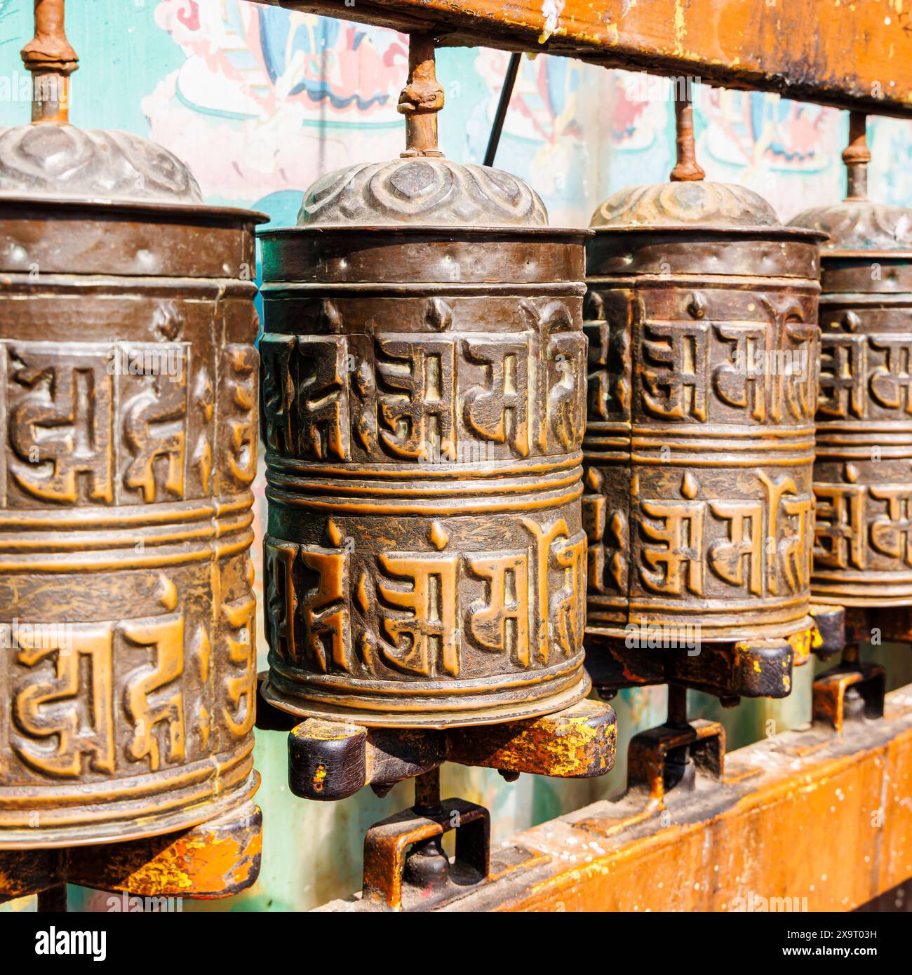 Traditional Buddhist wooden prayer wheels at the iconic Boudhanath ...