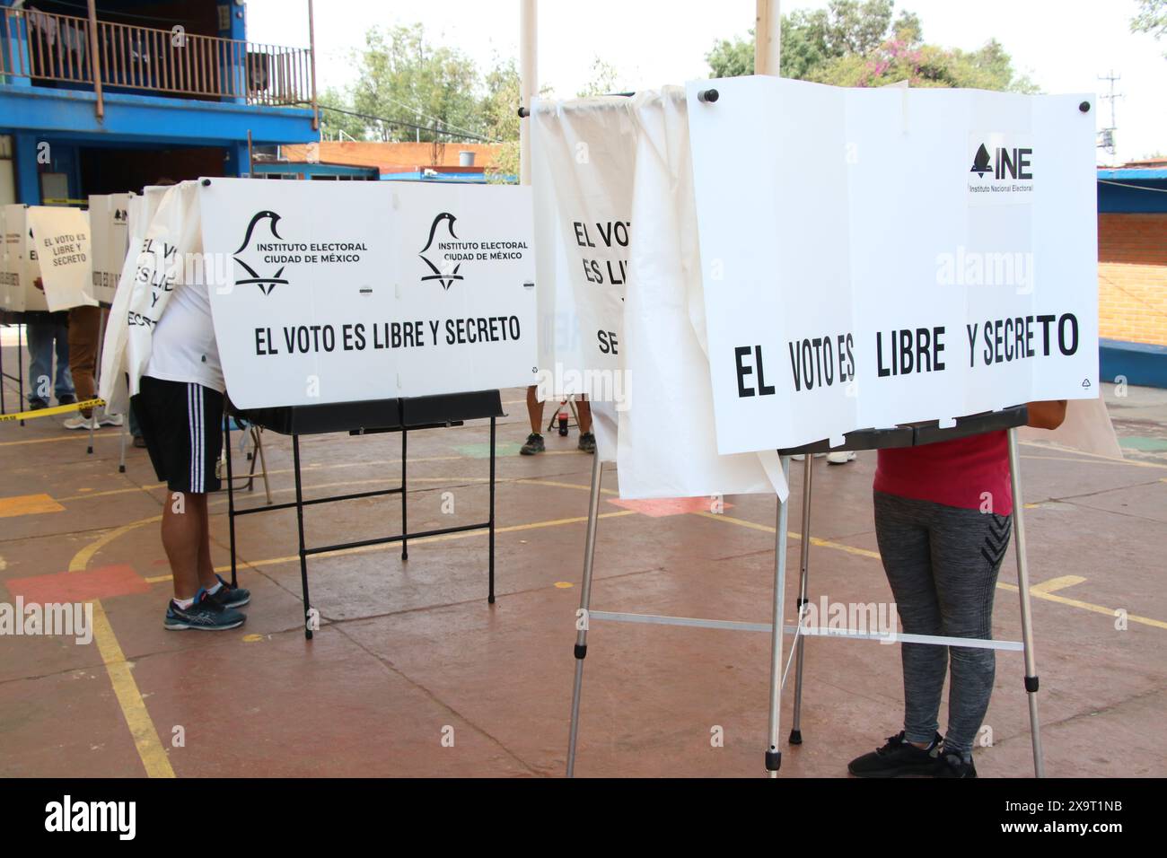 A Mexican citizen casting their vote at a ballot box during the 2024 ...