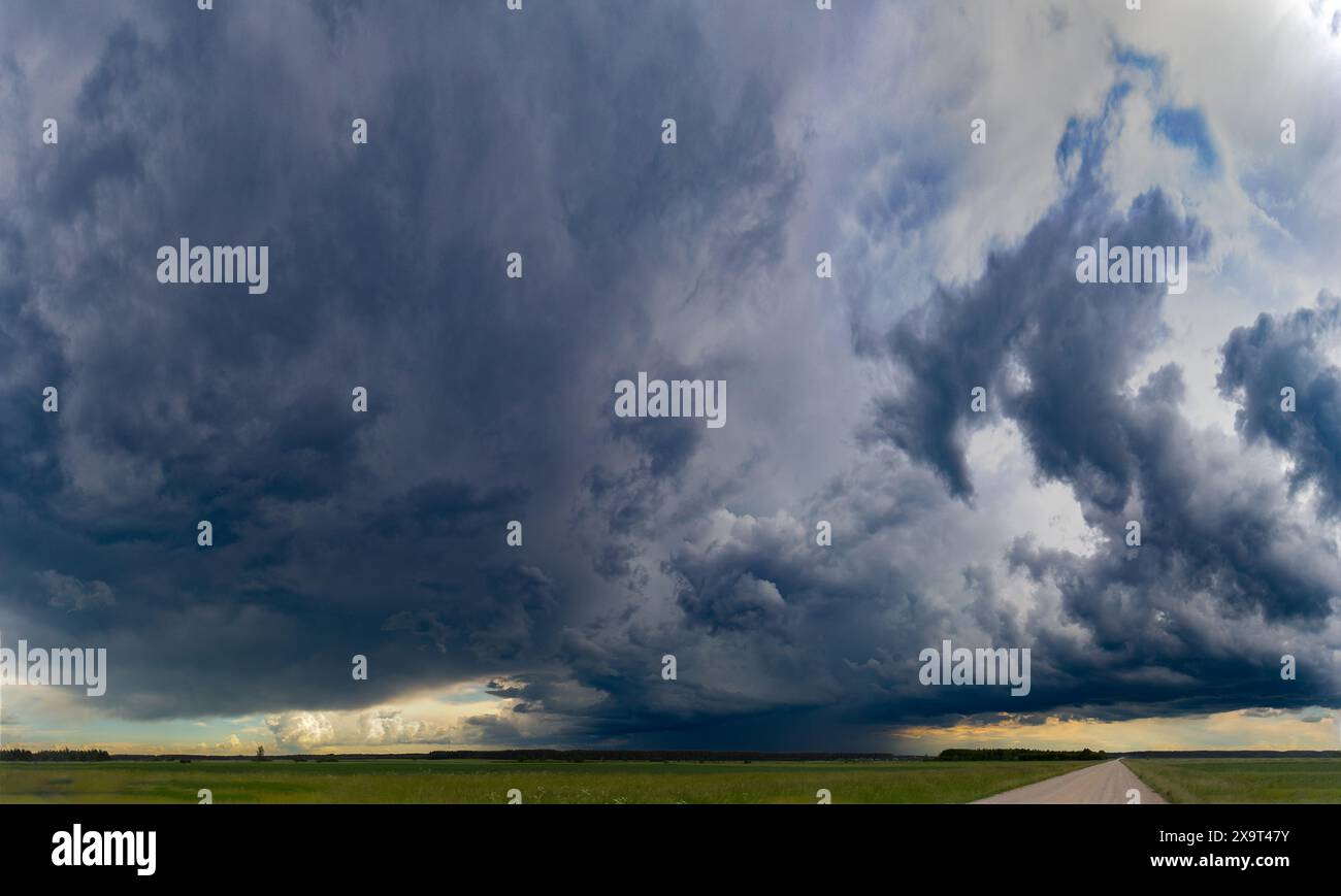 A large storm cloud with a raindrop Stock Photo - Alamy