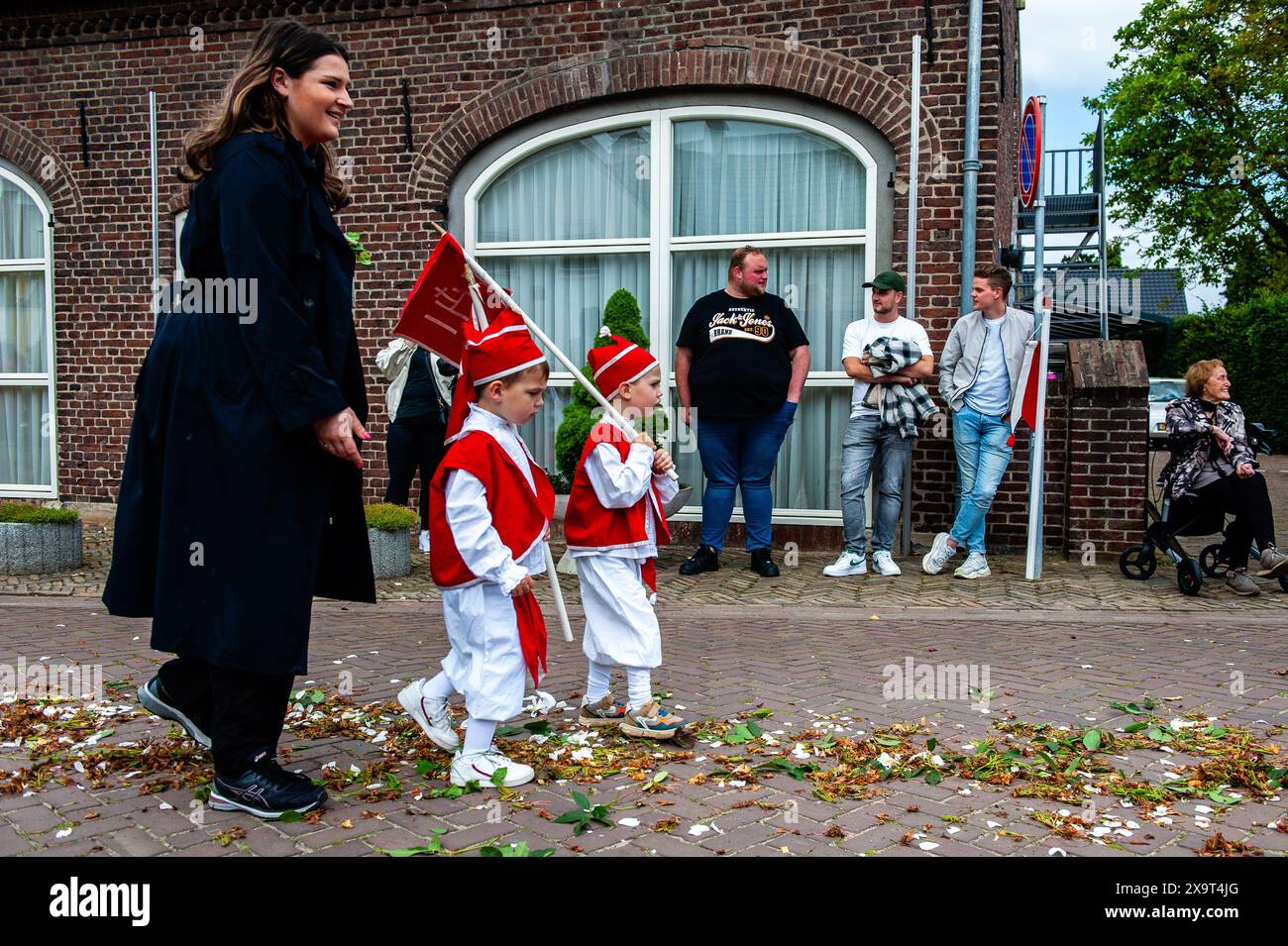 Some boys are seen accompanied by an adult during the "Boxmeerse Vaart ...