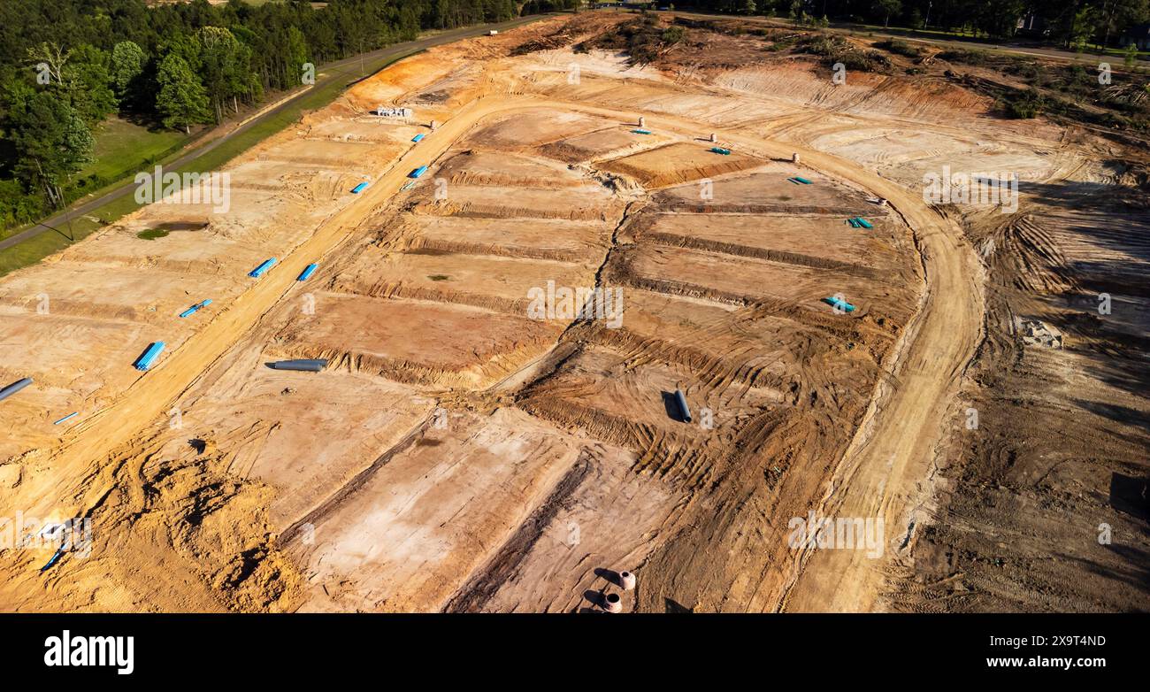 Graded dirt lots ready for new house and neighborhood construction ...