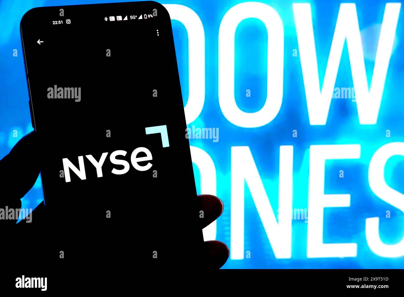 In this photo illustration, a NYSE (New York Stock Exchange) logo seen ...