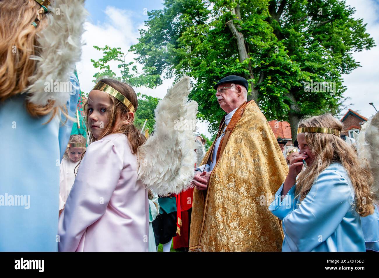 A little girl is seen covering her nose because of the incense during ...