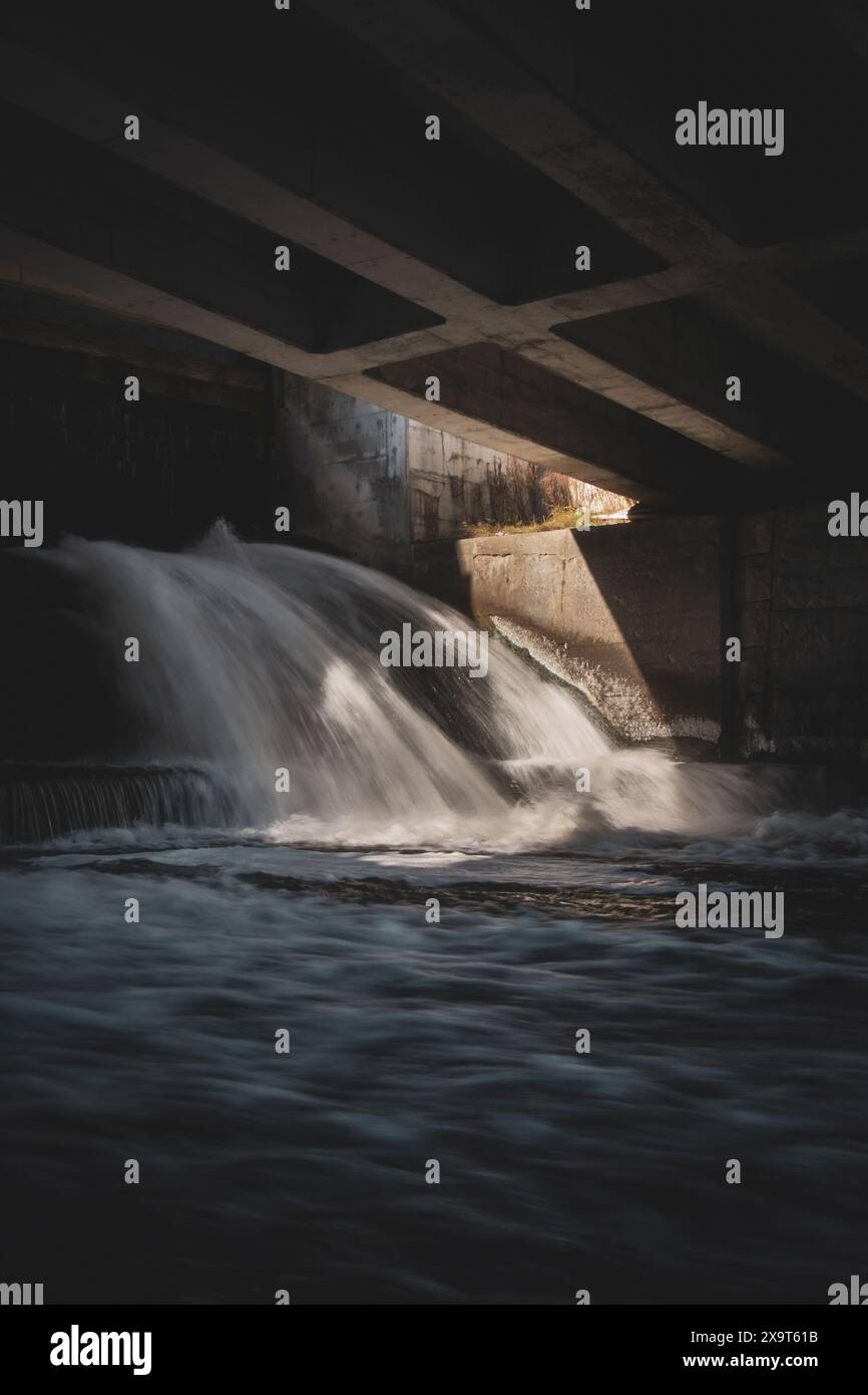 Time lapse photograph of rushing water being pushed out of the doors of ...