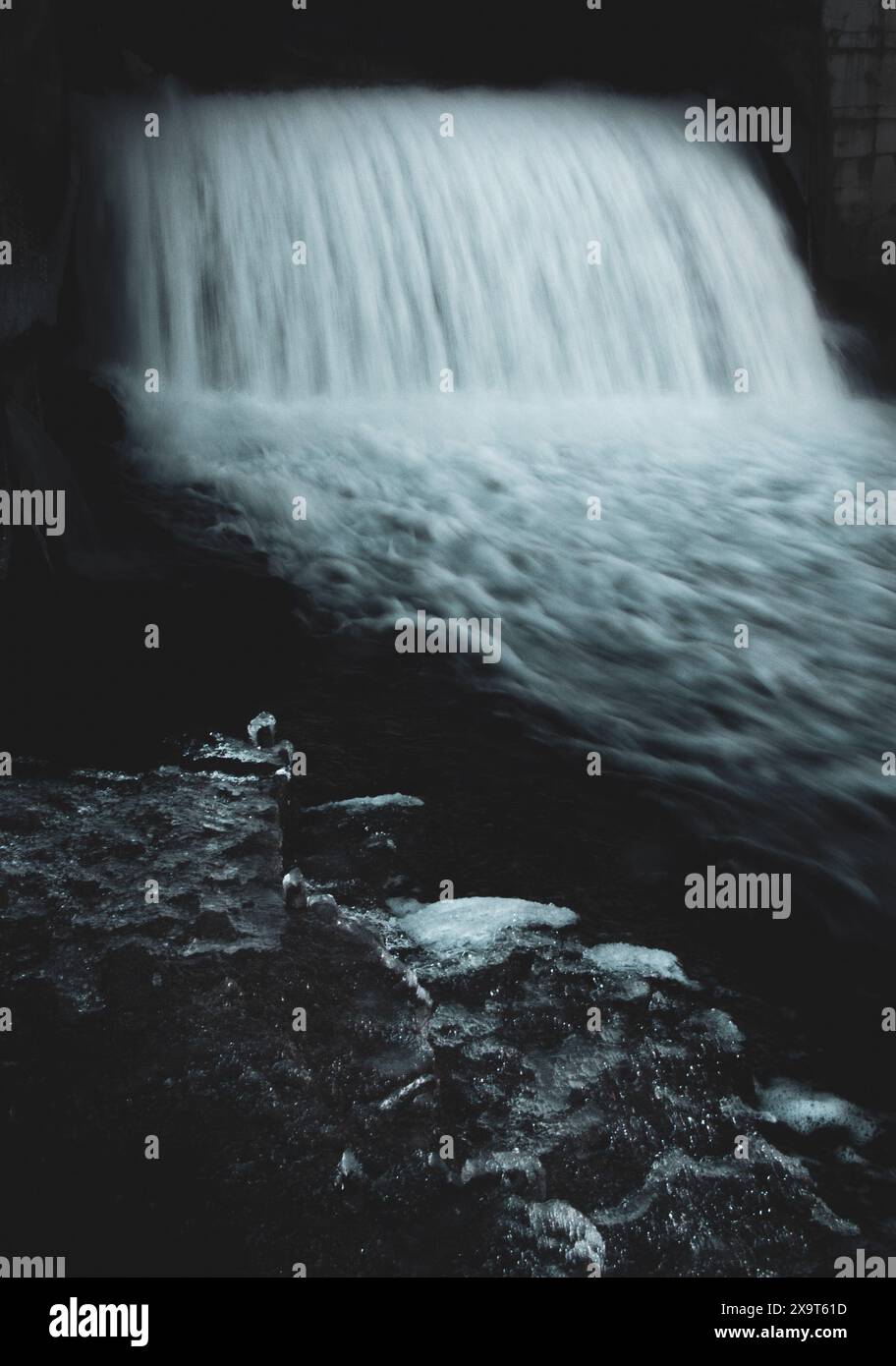 Time lapse photograph of rushing water being pushed out of the doors of ...