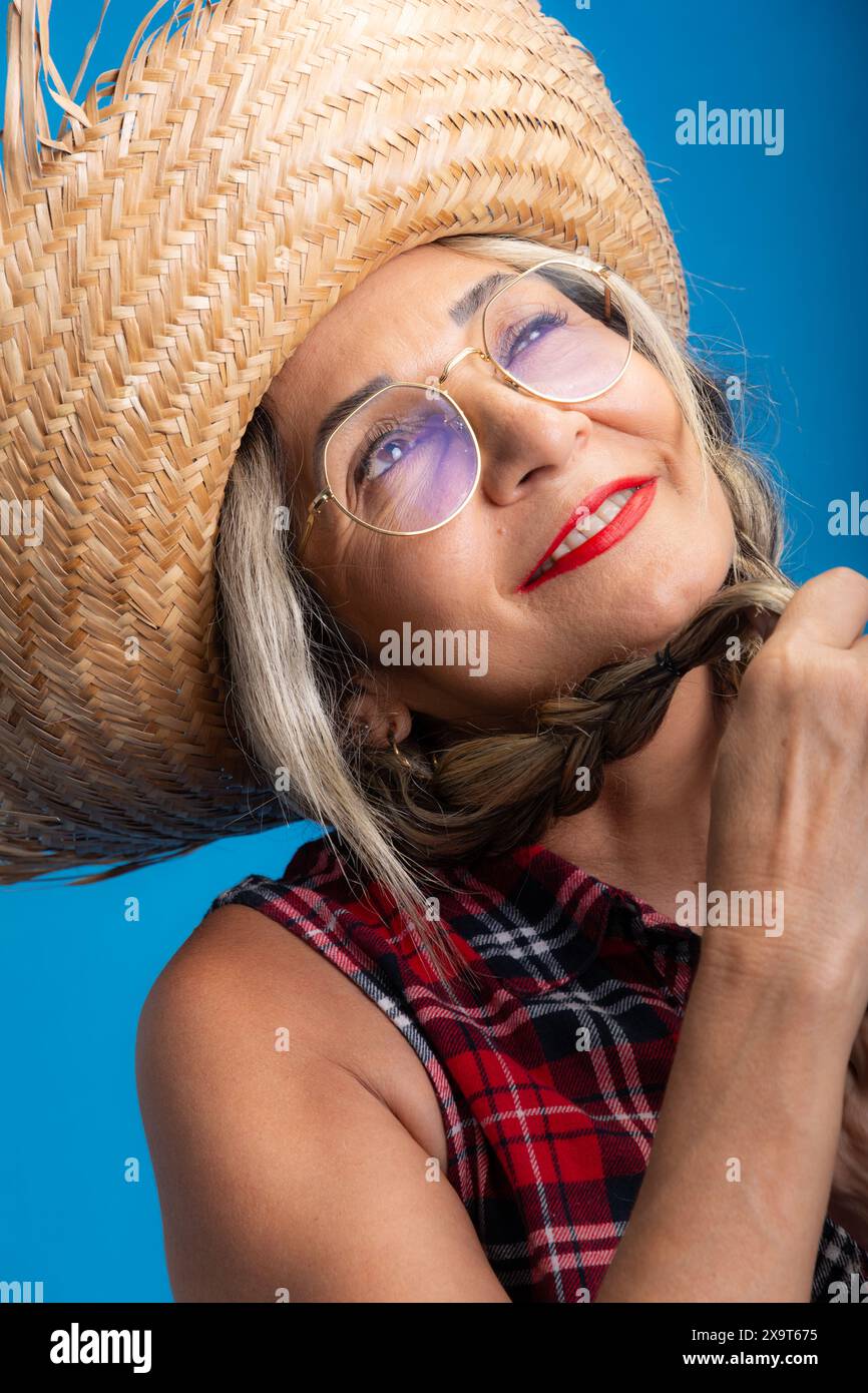 Close-up portrait of a beautiful woman, in checkered clothing typical ...