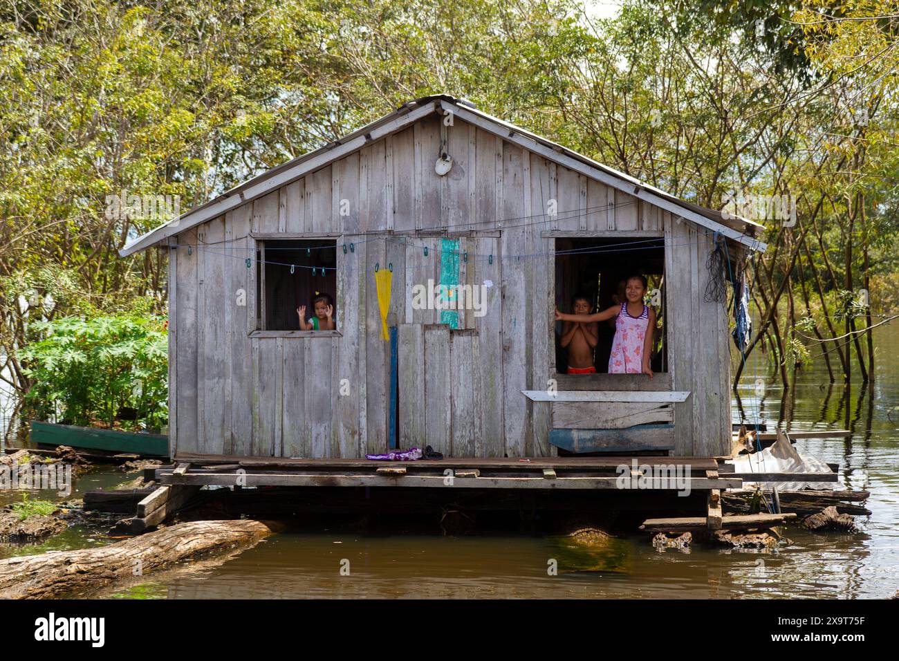 Floating house, kids at the window, on the Amazon Stock Photo - Alamy