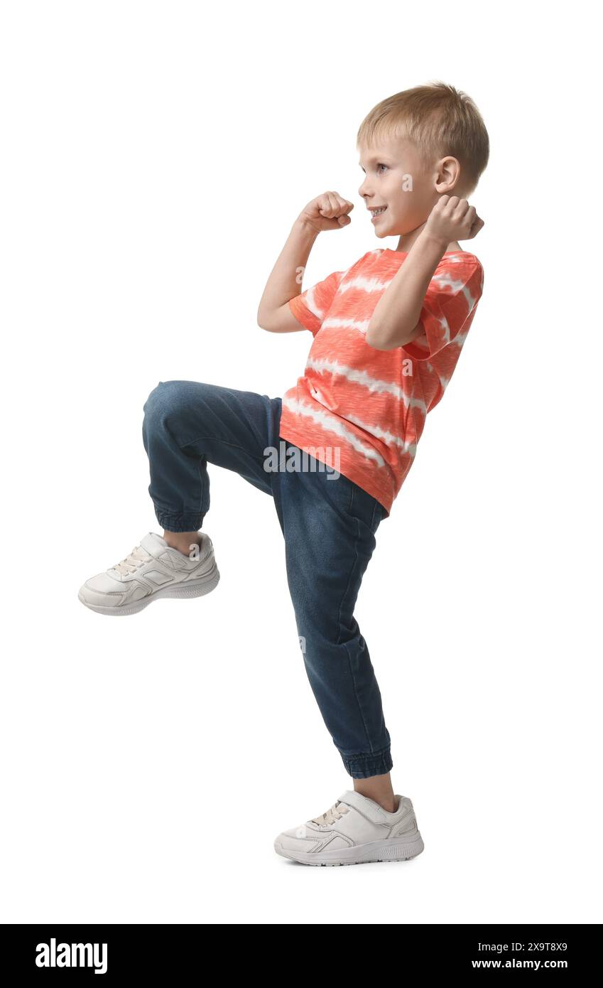 Happy little boy dancing on white background Stock Photo - Alamy