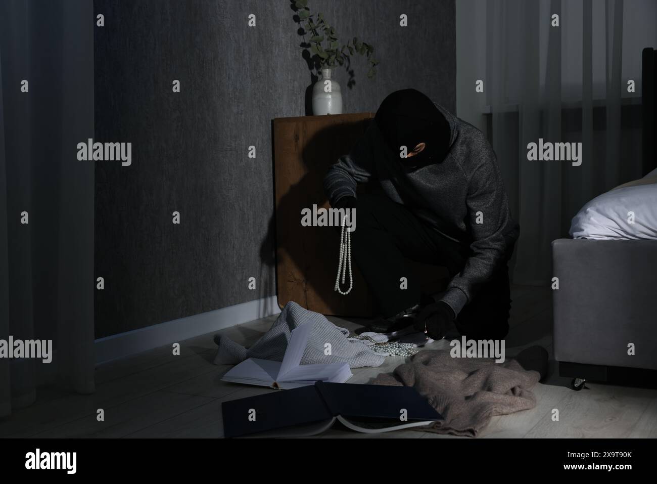 Thief stealing jewels in foreign house. Burglary Stock Photo - Alamy