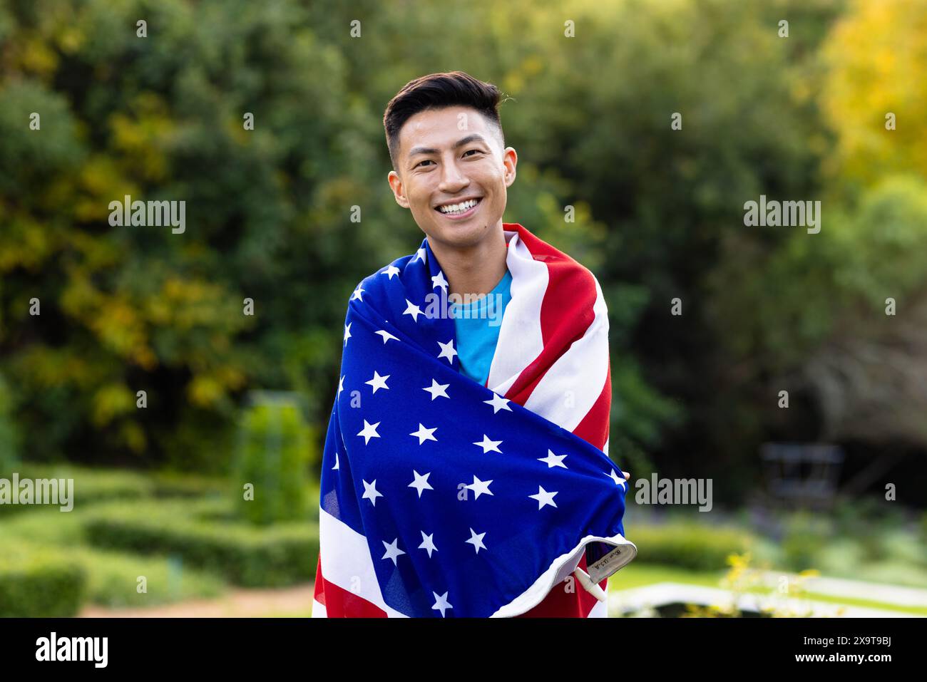 Young asian man flag hi-res stock photography and images - Alamy