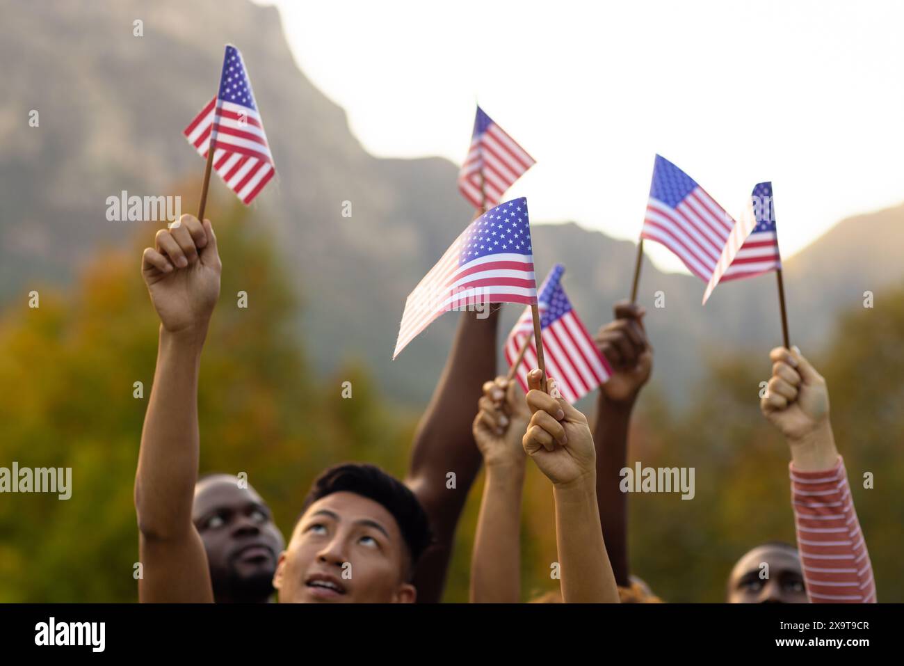 Happy diverse friends raising flags of usa in garden Stock Photo - Alamy