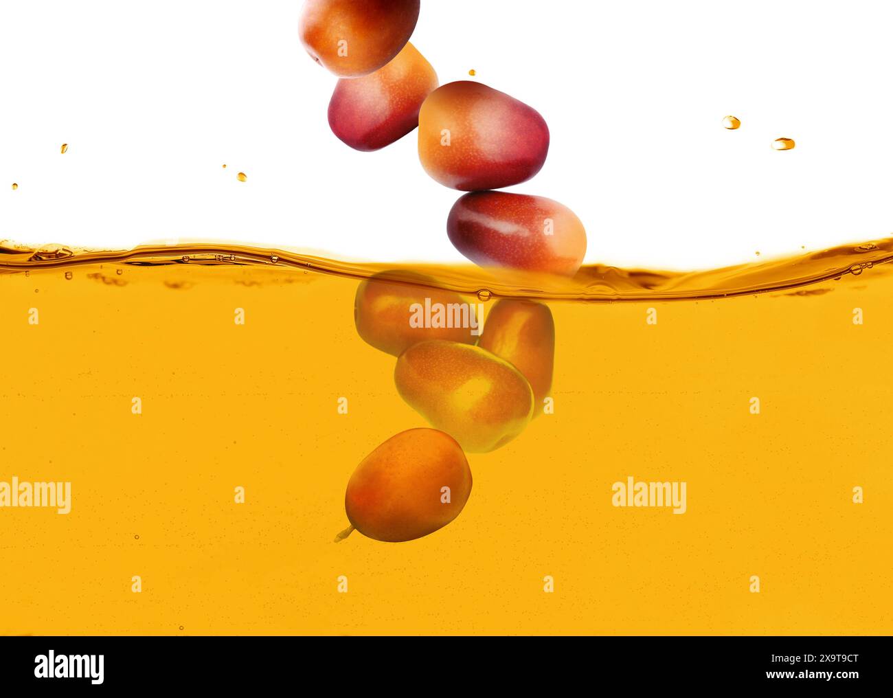Palm fruits falling into cooking oil on white background Stock Photo ...