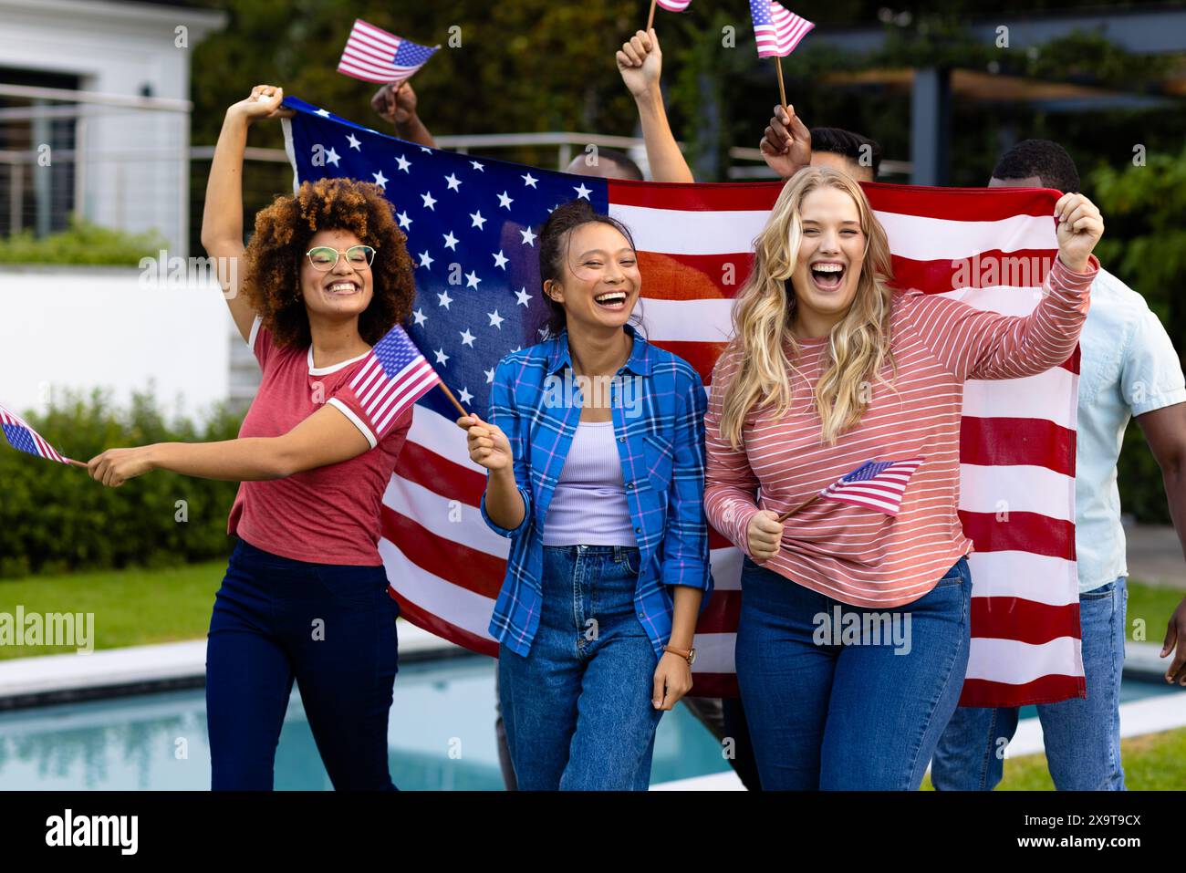 Portrait of happy diverse friends with flags of usa in garden Stock ...