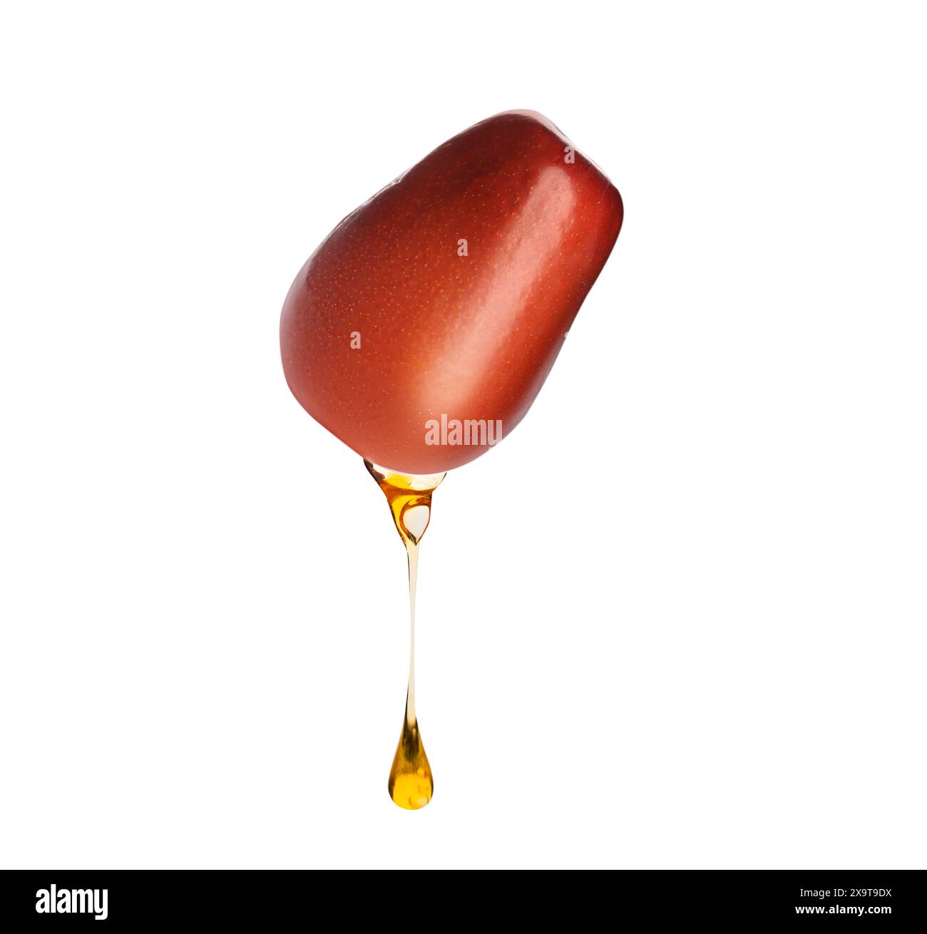 Oil dripping from palm fruit on white background Stock Photo - Alamy