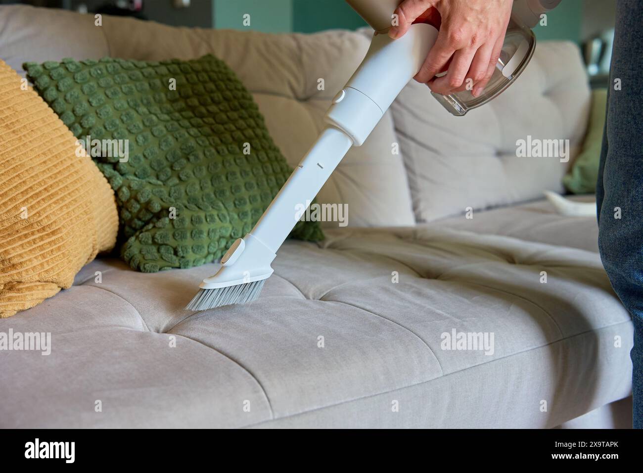 Cleaning couch using portable hi-res stock photography and images - Alamy