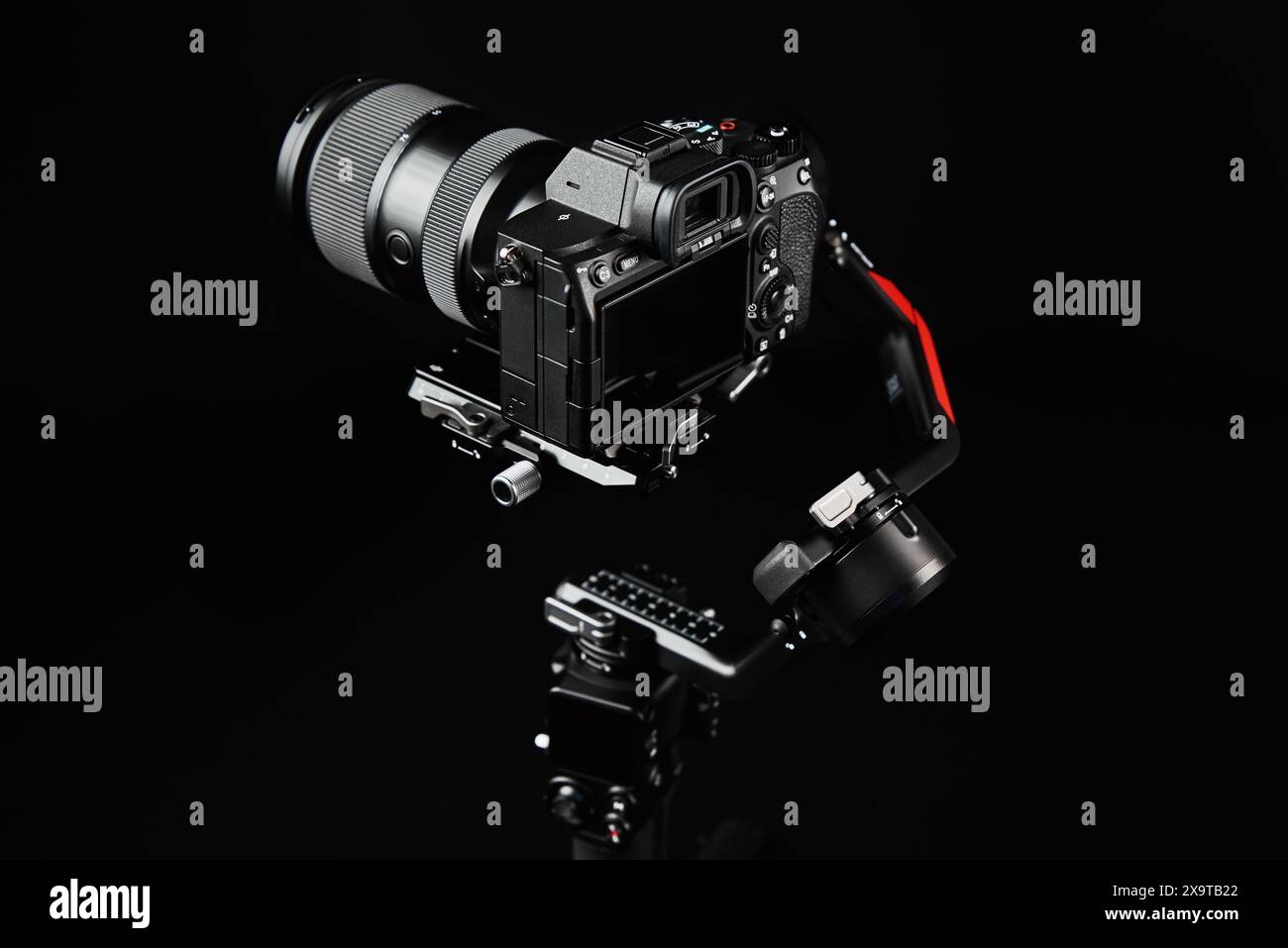 Camera mounted on gimbal on dark background. Camera stabilization ...