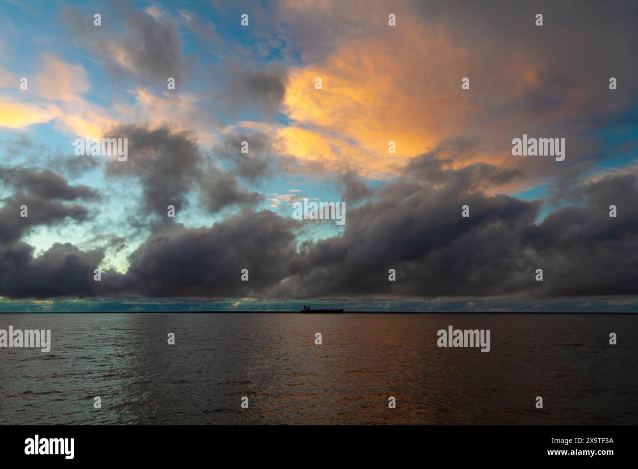 Cargo ship in dramatic scenery on Amazon river wide shot Stock Photo ...
