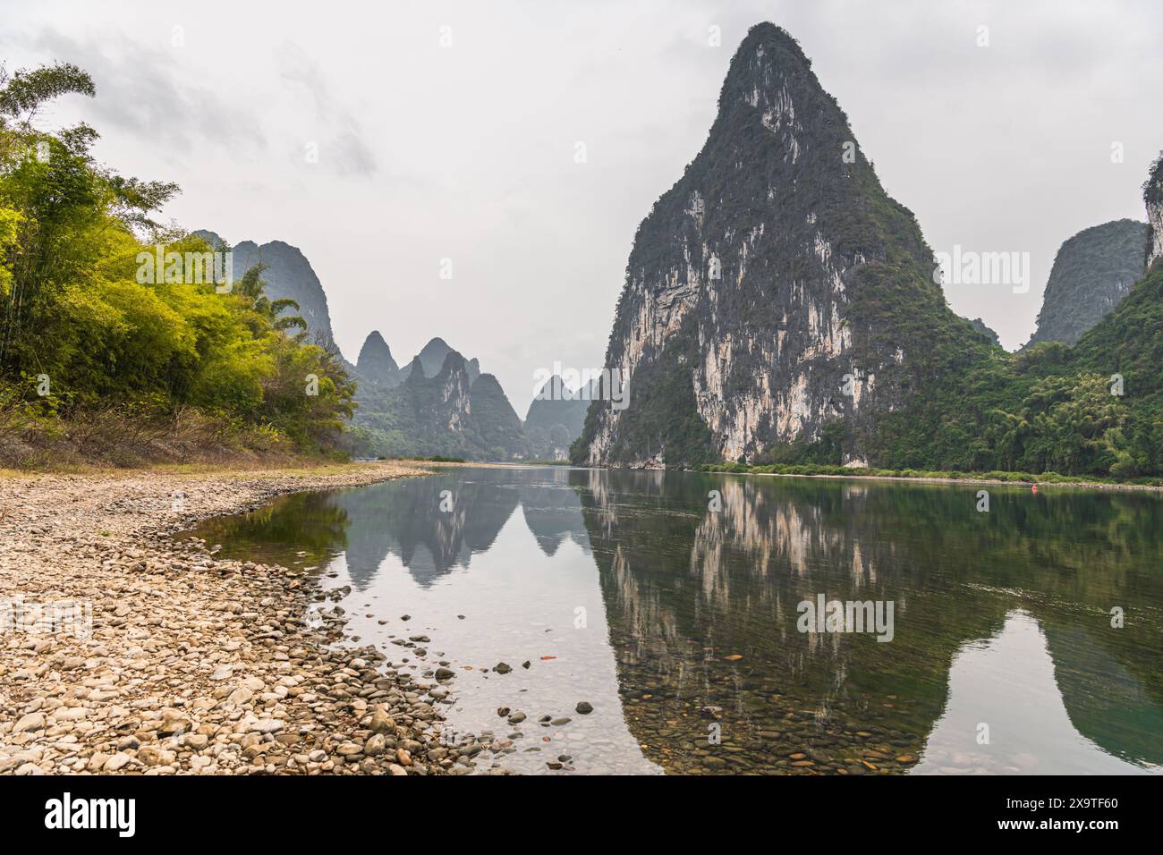The shores of the Li river in Xing Ping, Guilin, China. Cloudy sky with ...