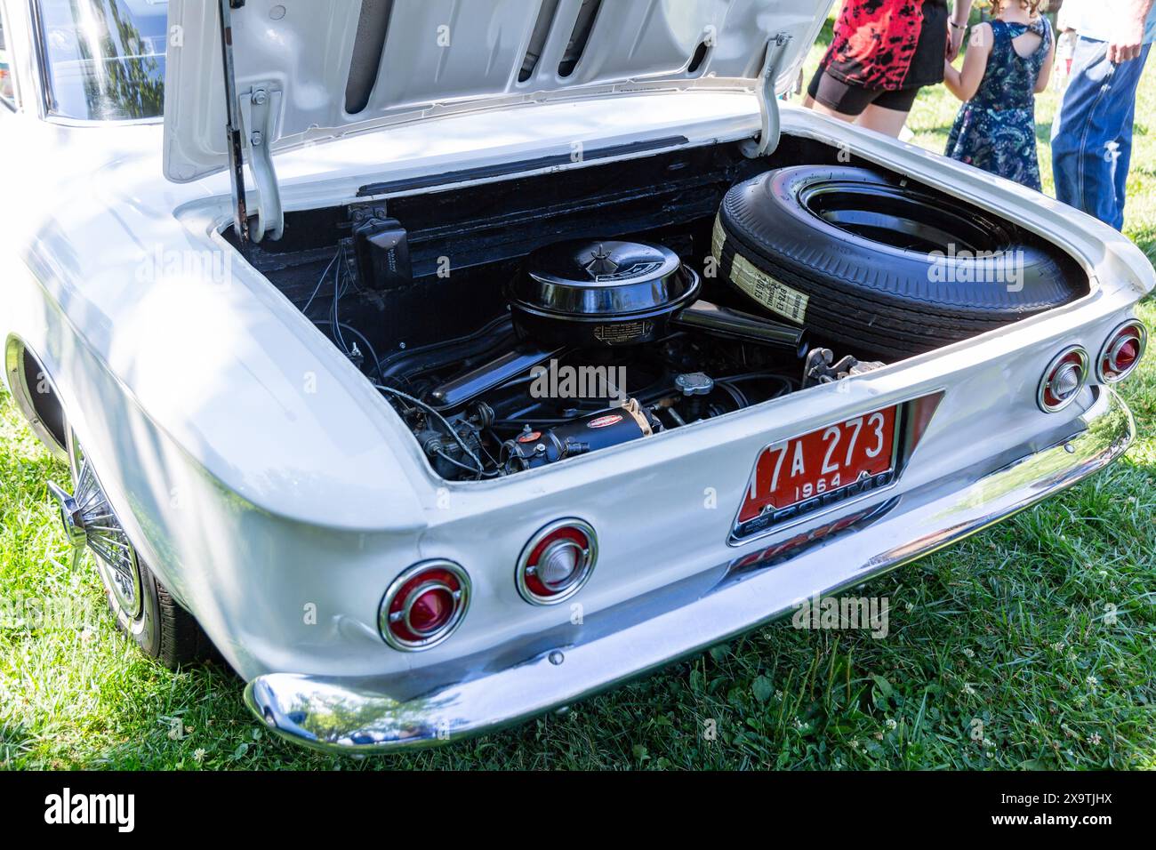 The hood of this white rear-engine 1964 Chevrolet Corvair is open for ...