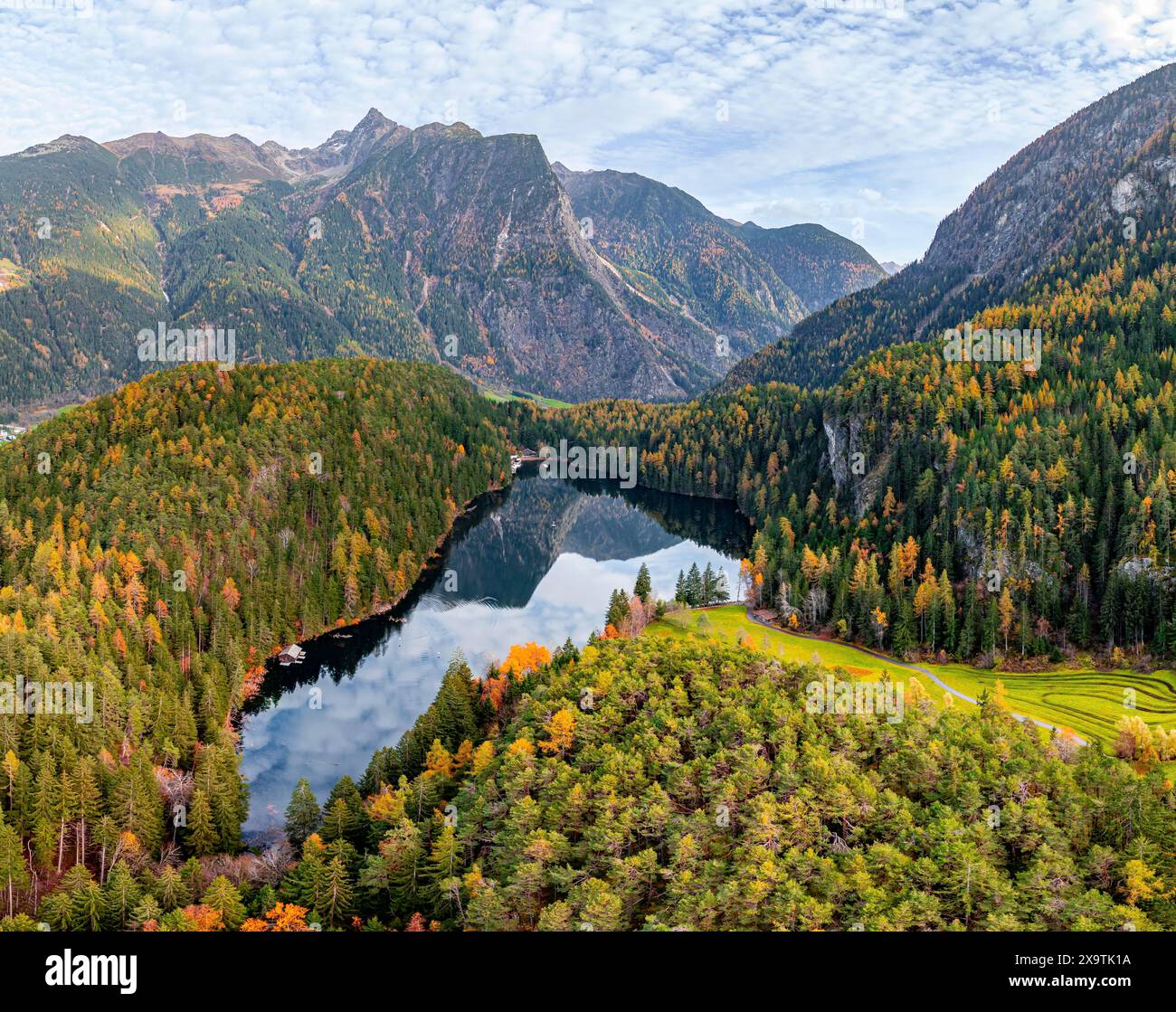 Aerial view, mountain peaks of the Oetztal Alps reflected in Lake ...