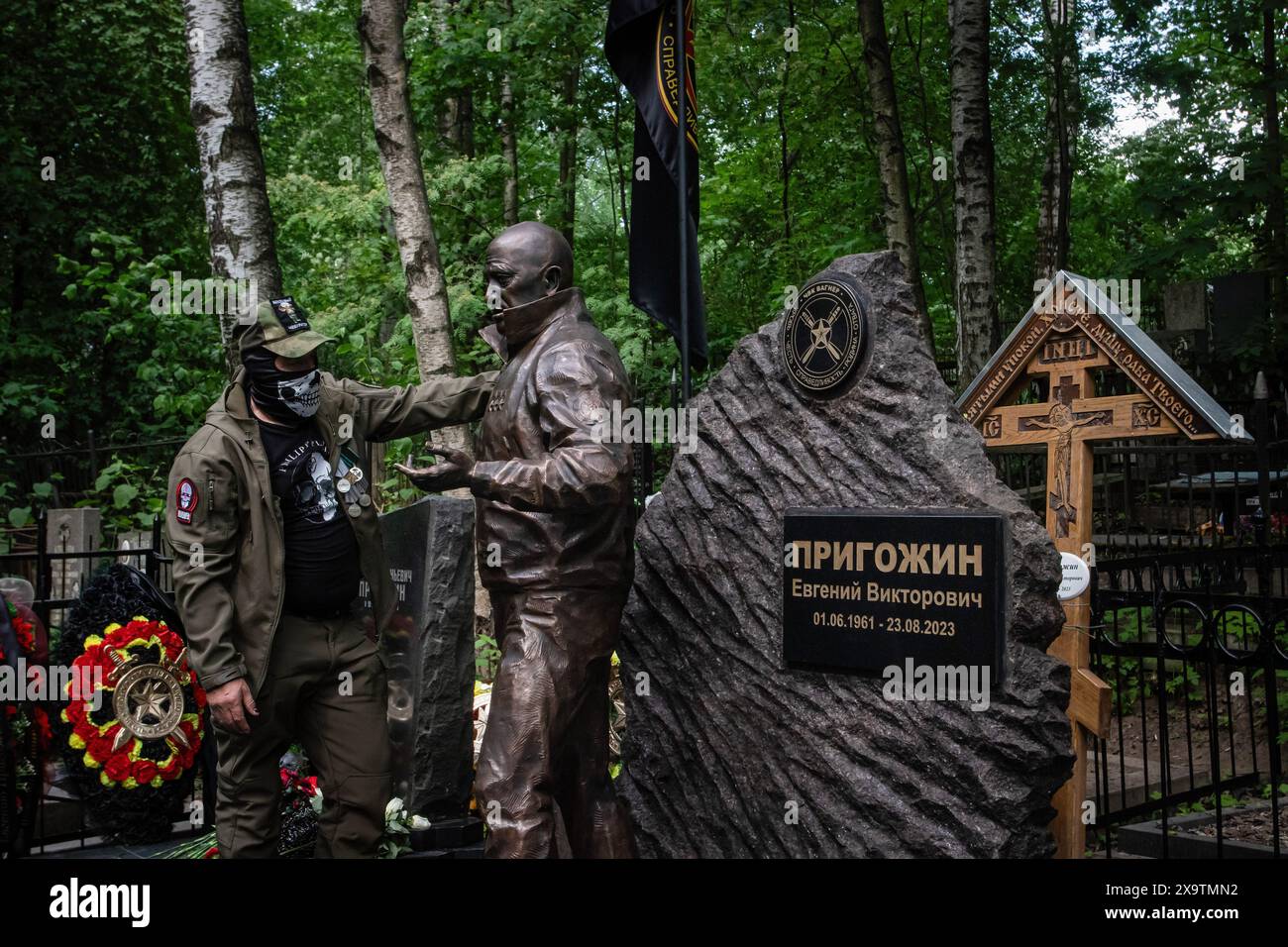 A fighter of the Wagner PMC stands near the installed sculpture of the ...