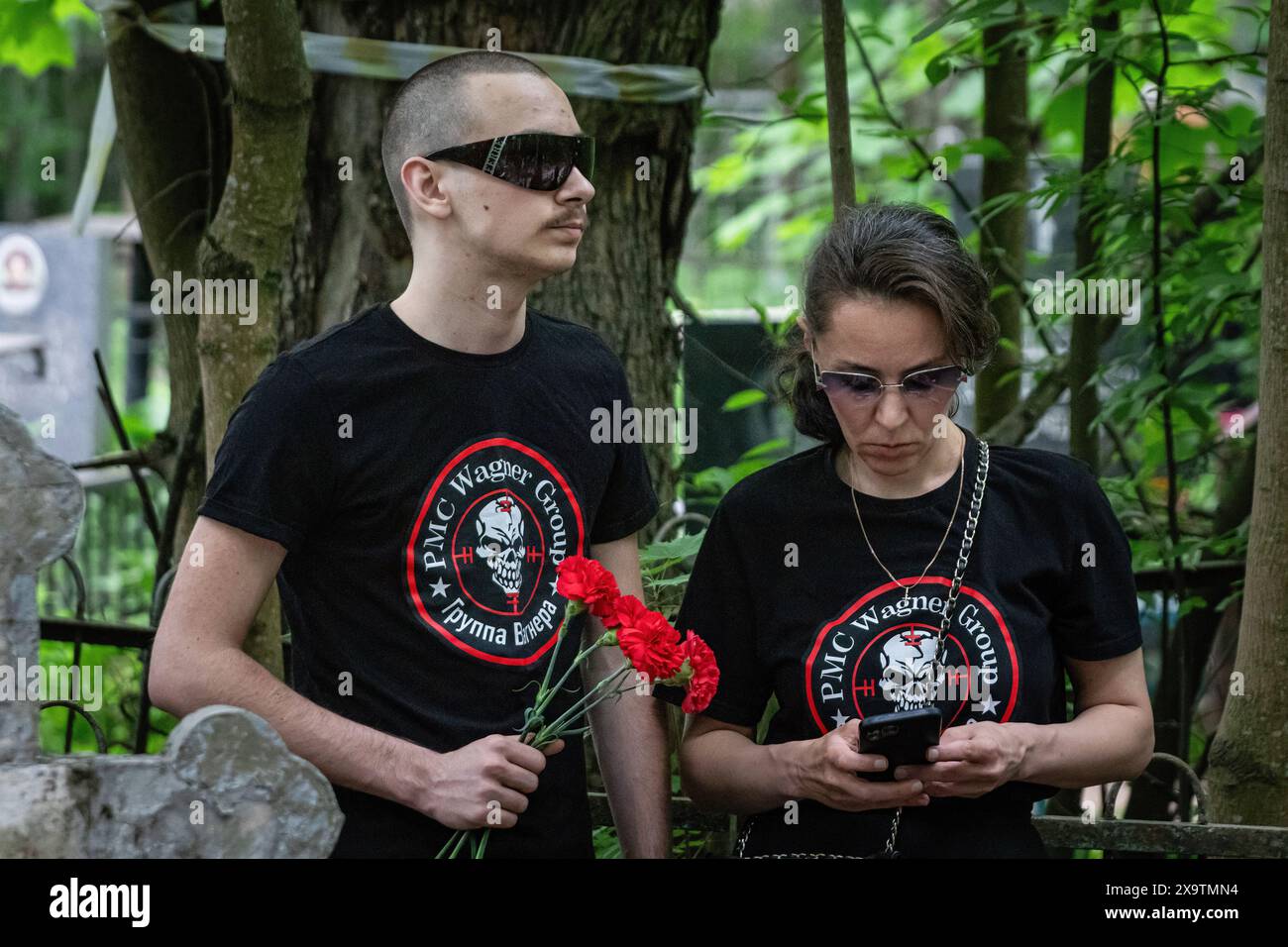 Civilians seen wearing t-shirts with the symbols of the Wagner PMC near ...