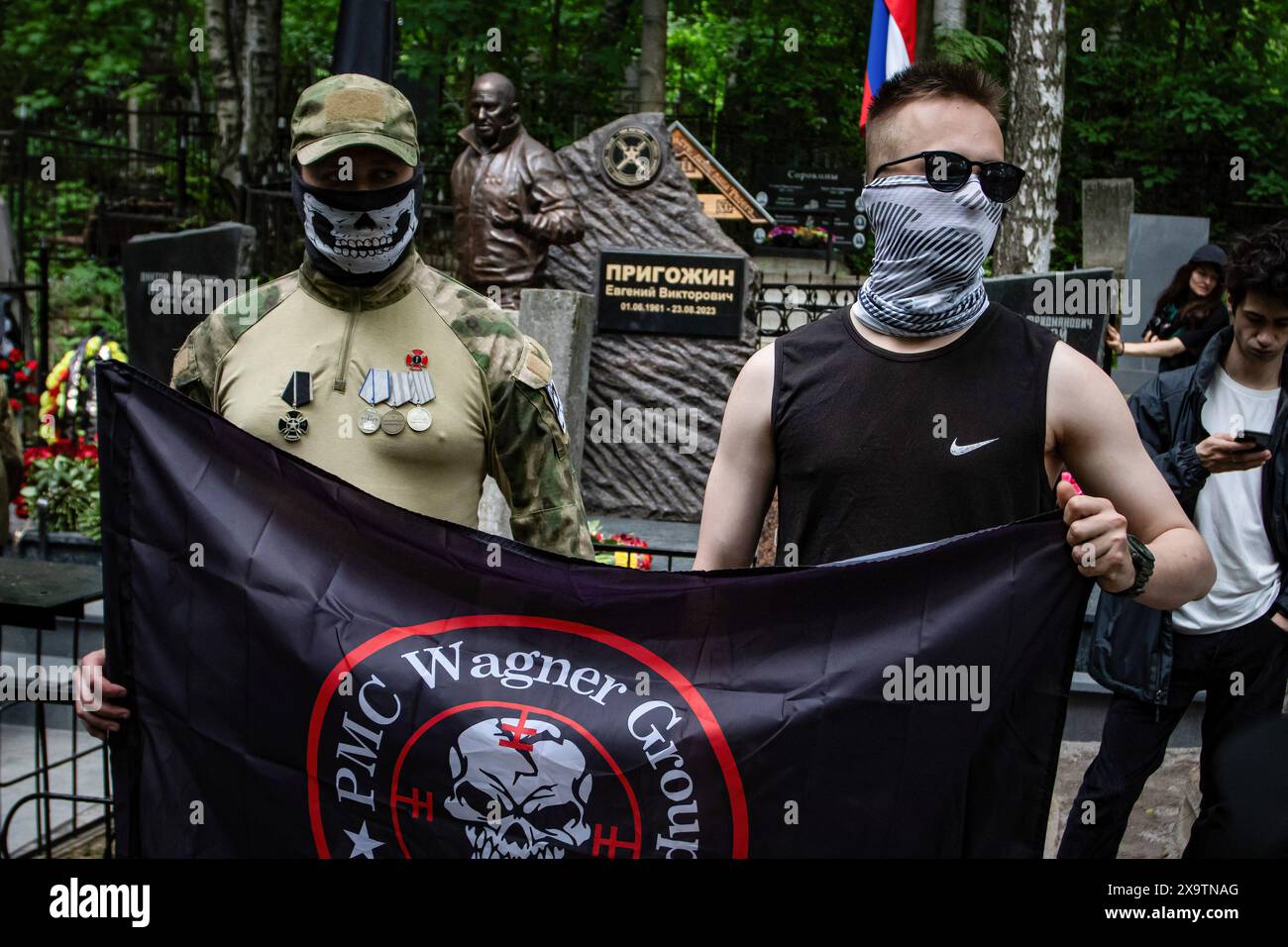 Fighters of the private military group "Wagner" stand near the ...