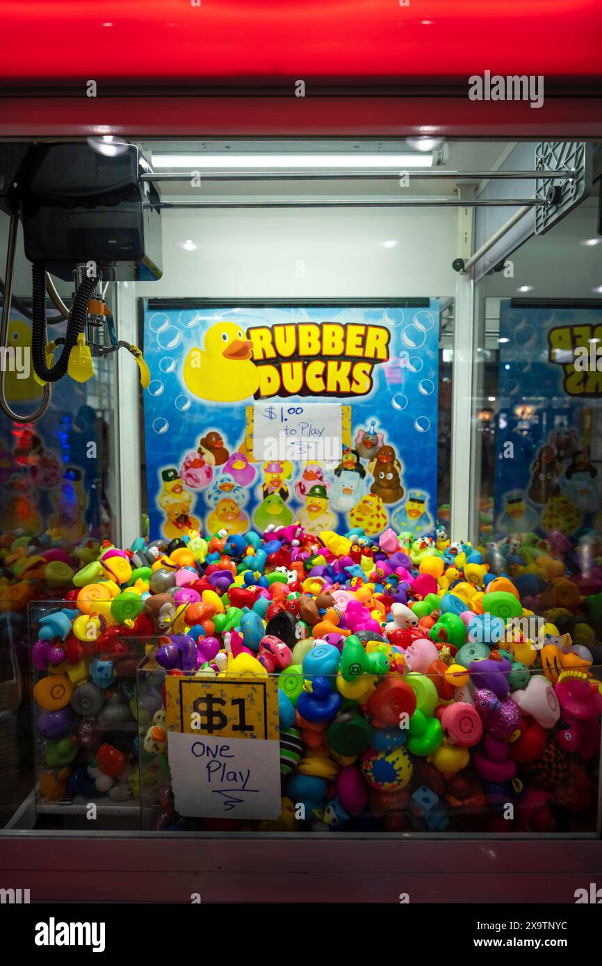 Rubber duck claw crane game Stock Photo - Alamy