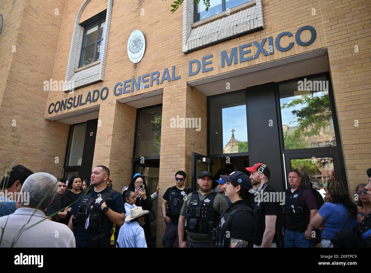 Police block off the entrances to the Mexican consulate as thousands of ...