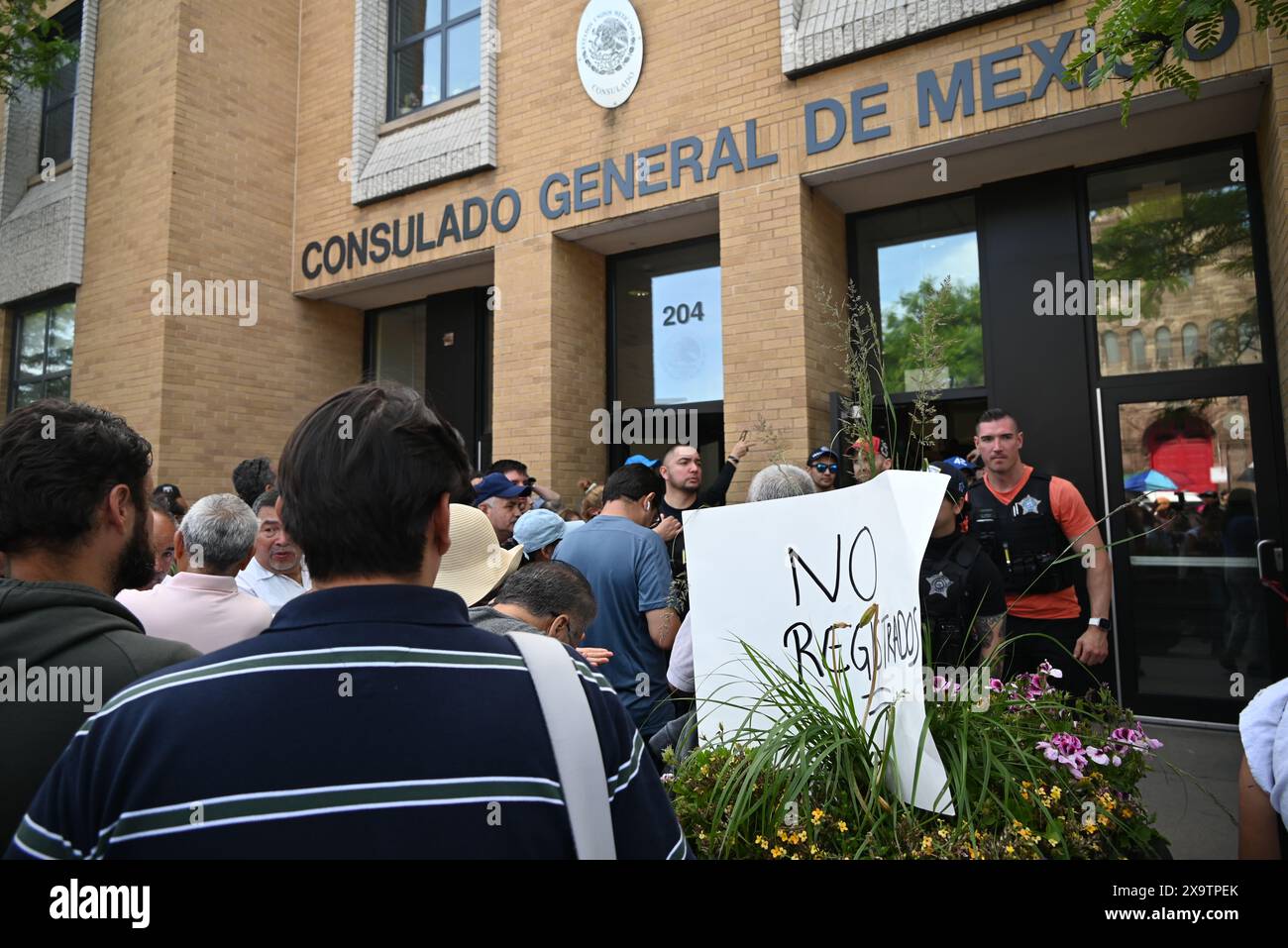 Police block off the entrances to the Mexican consulate as thousands of ...