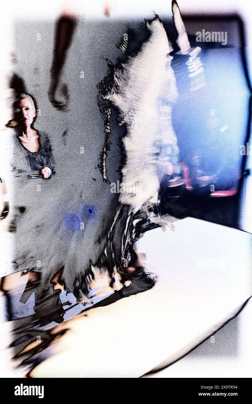 Model walking, blurred image of a dress, motion solarized & abstract ...